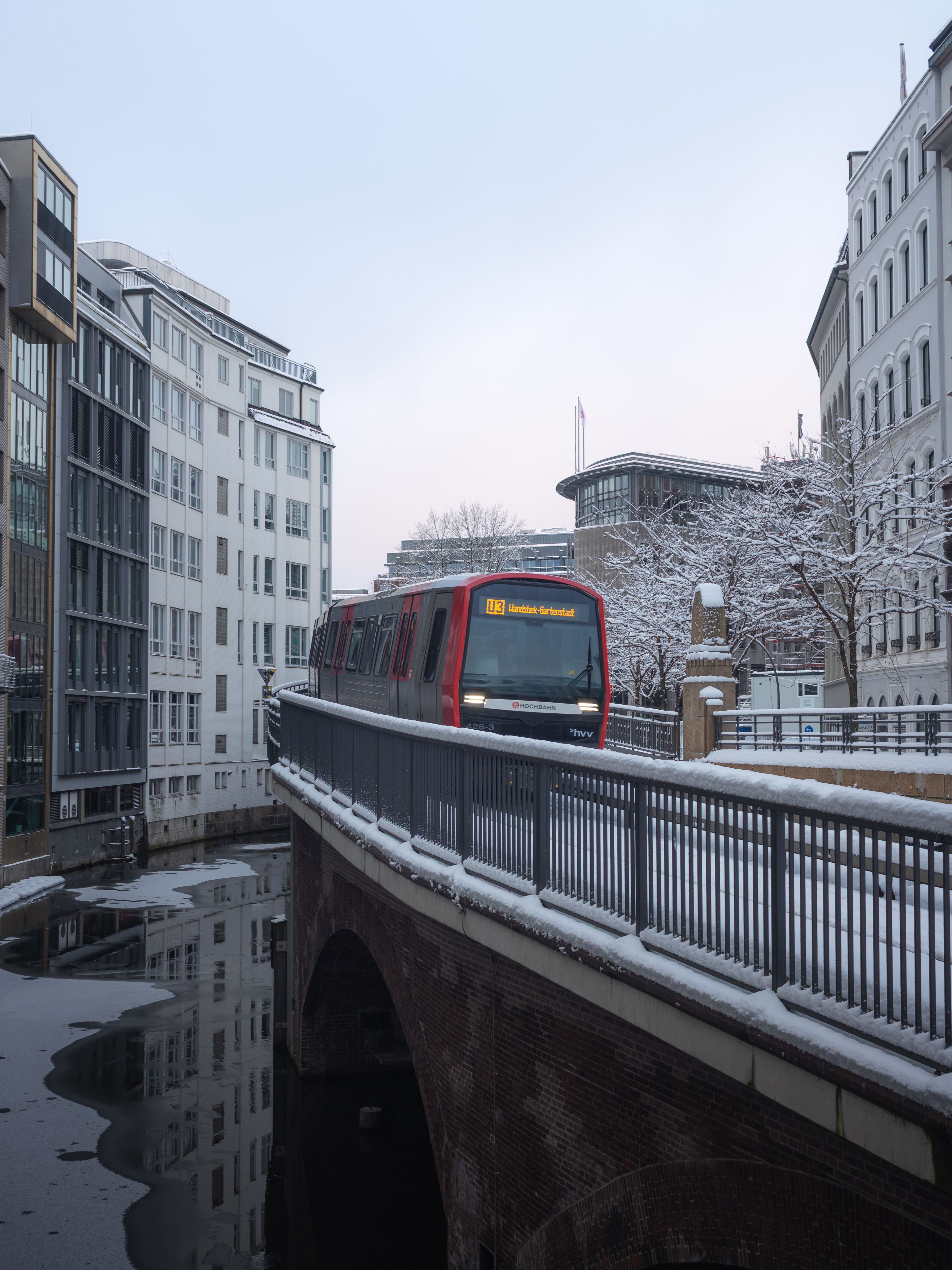 Winter Scene of Train Crossing Bridge in Hamburg · Free Stock Photo
