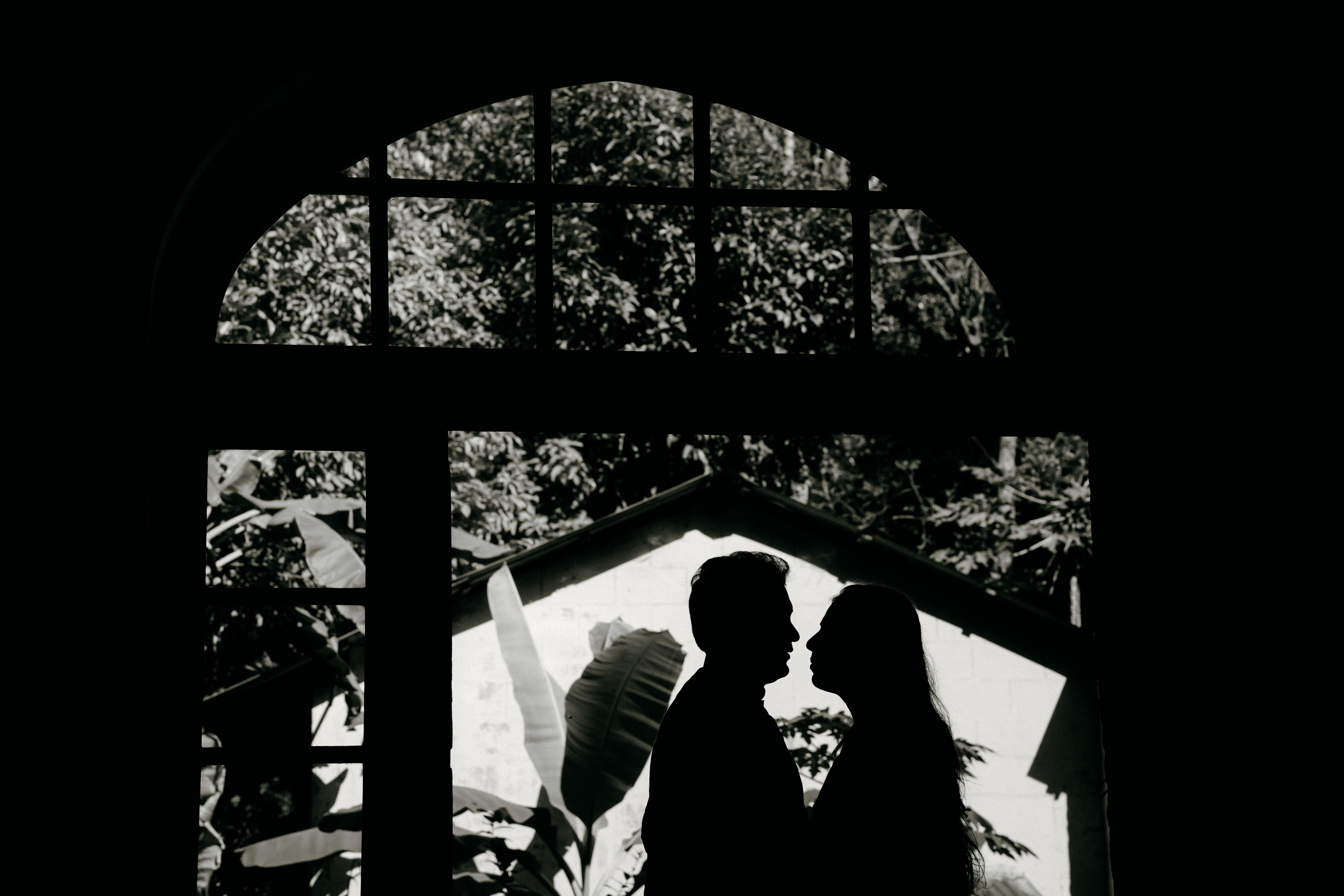 Romantic Couple Silhouette at Window · Free Stock Photo