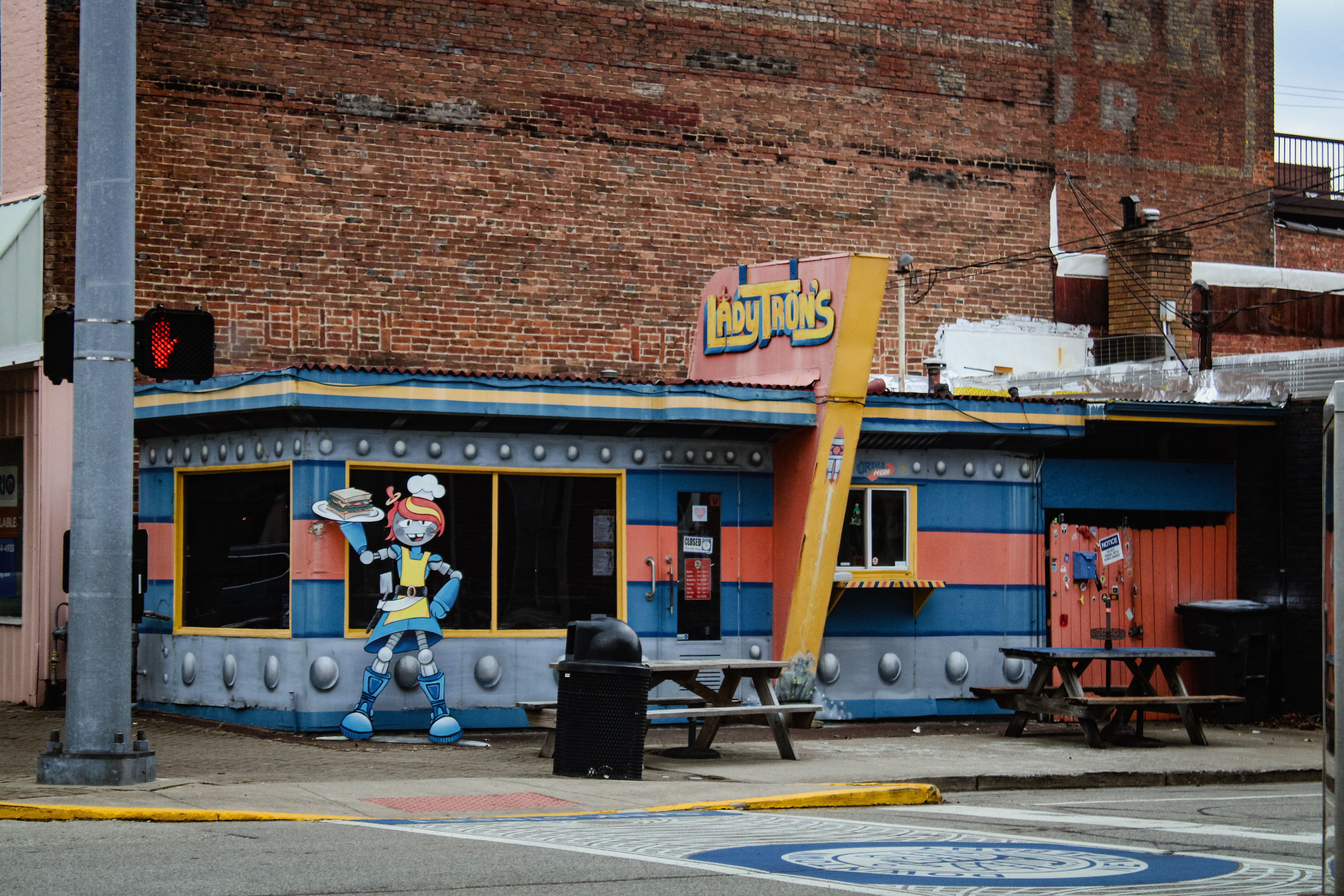 Colorful Retro Diner in Historic Brick Building · Free Stock Photo