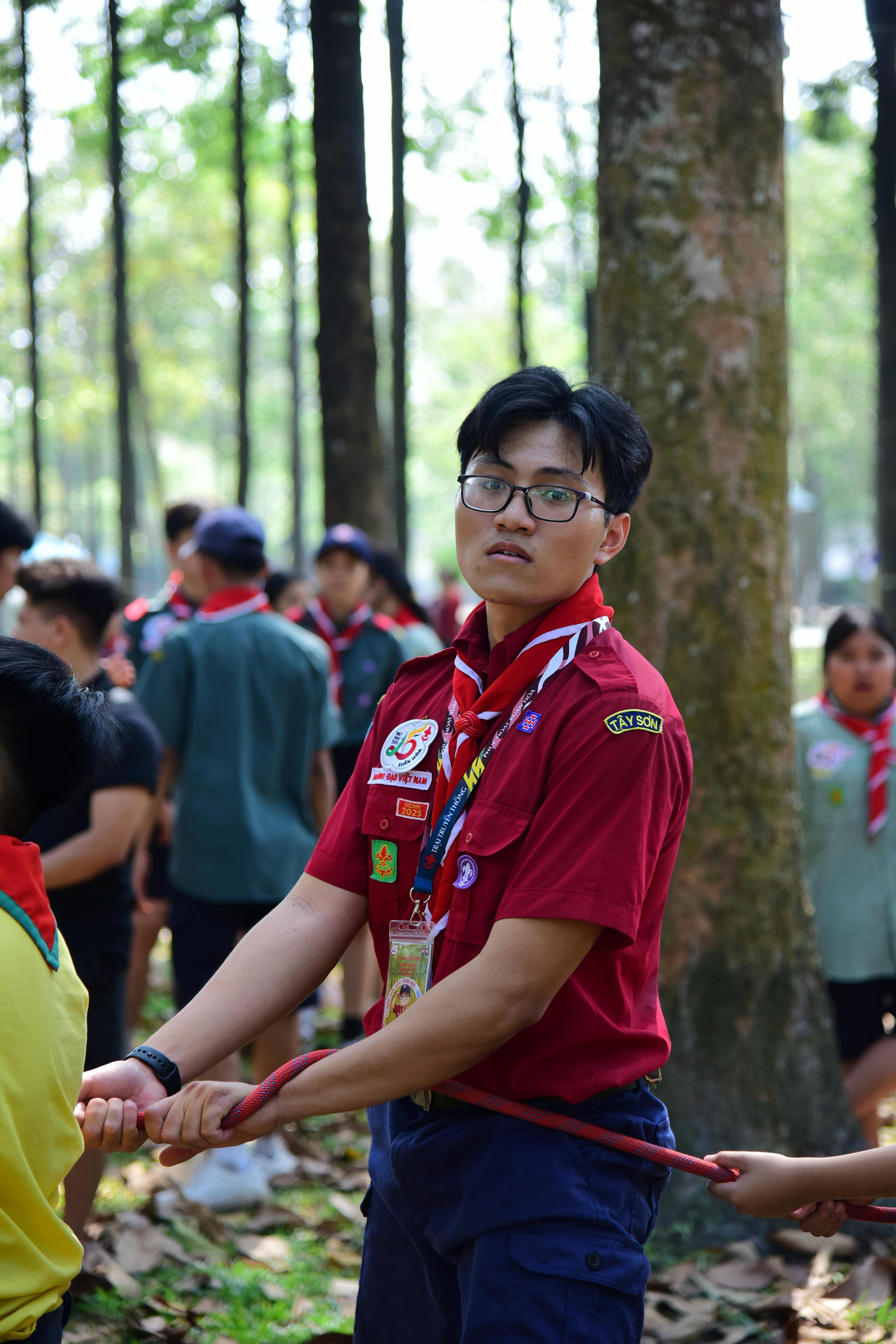 Boy Scout Participating in Outdoor Team Activity · Free Stock Photo