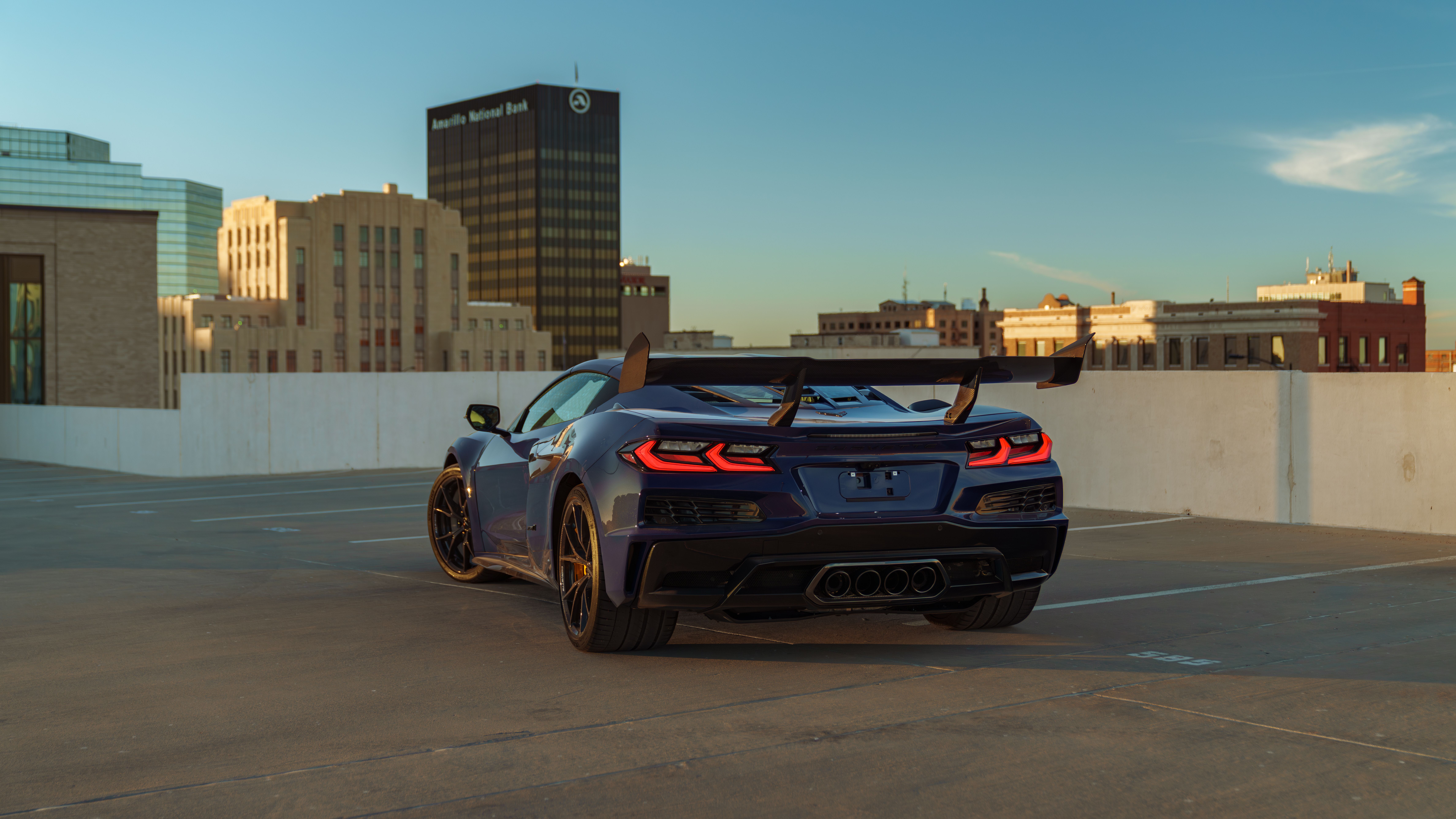 Luxury Sports Car on Rooftop at Sunset · Free Stock Photo