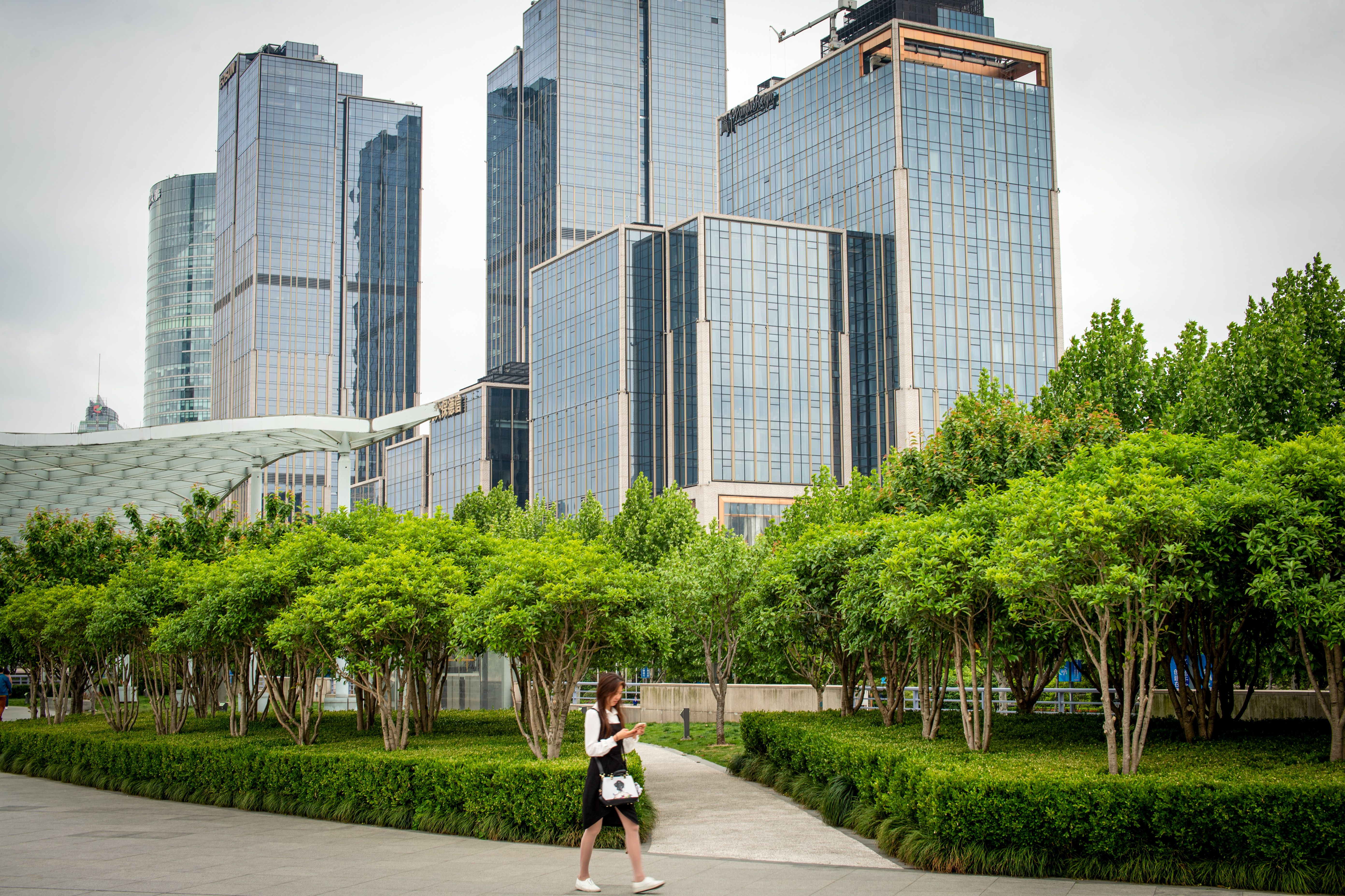 Modern Shanghai Skyscrapers with Lush Greenery · Free Stock Photo