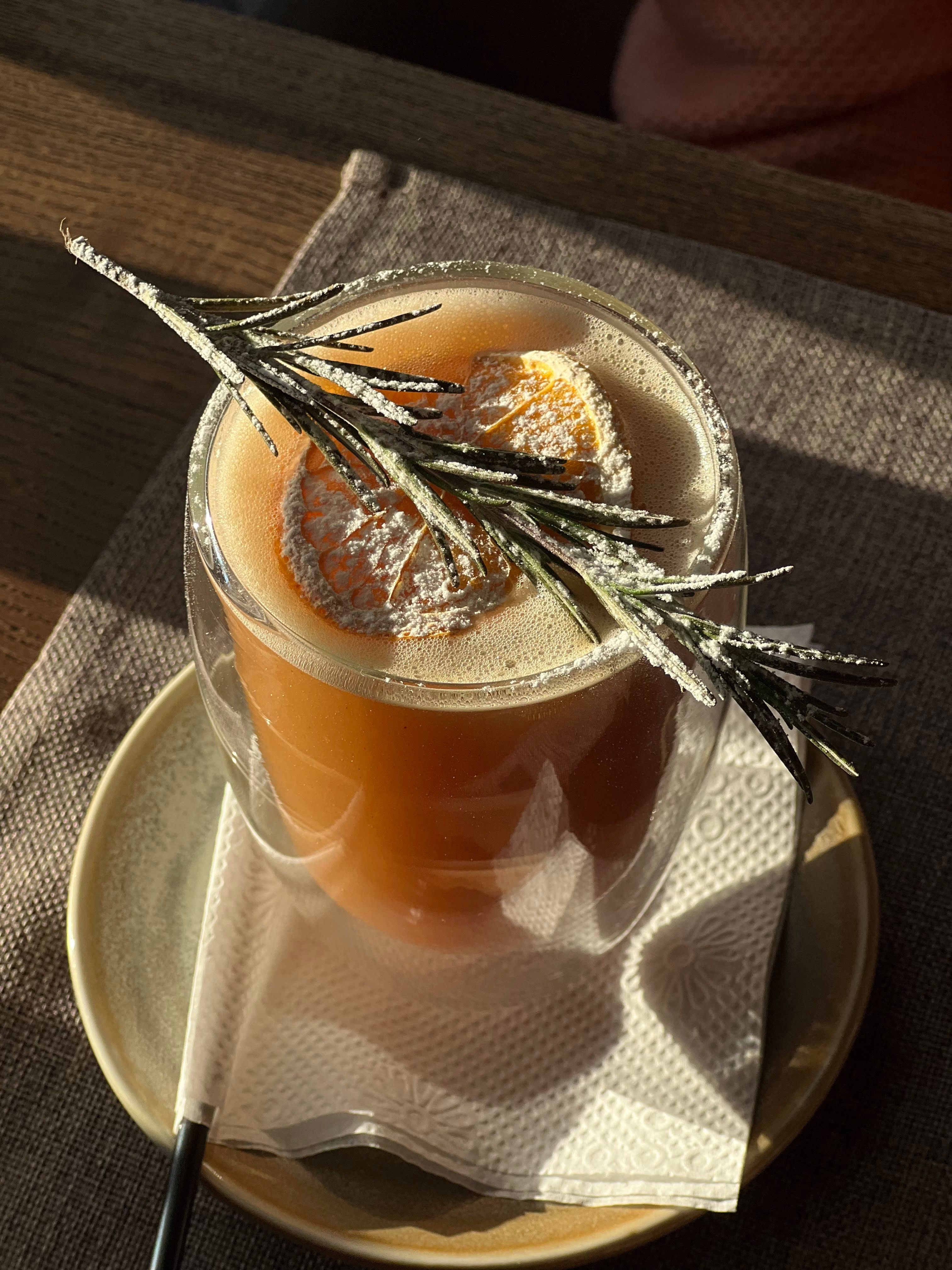 Cozy Winter Beverage with Citrus and Rosemary · Free Stock Photo