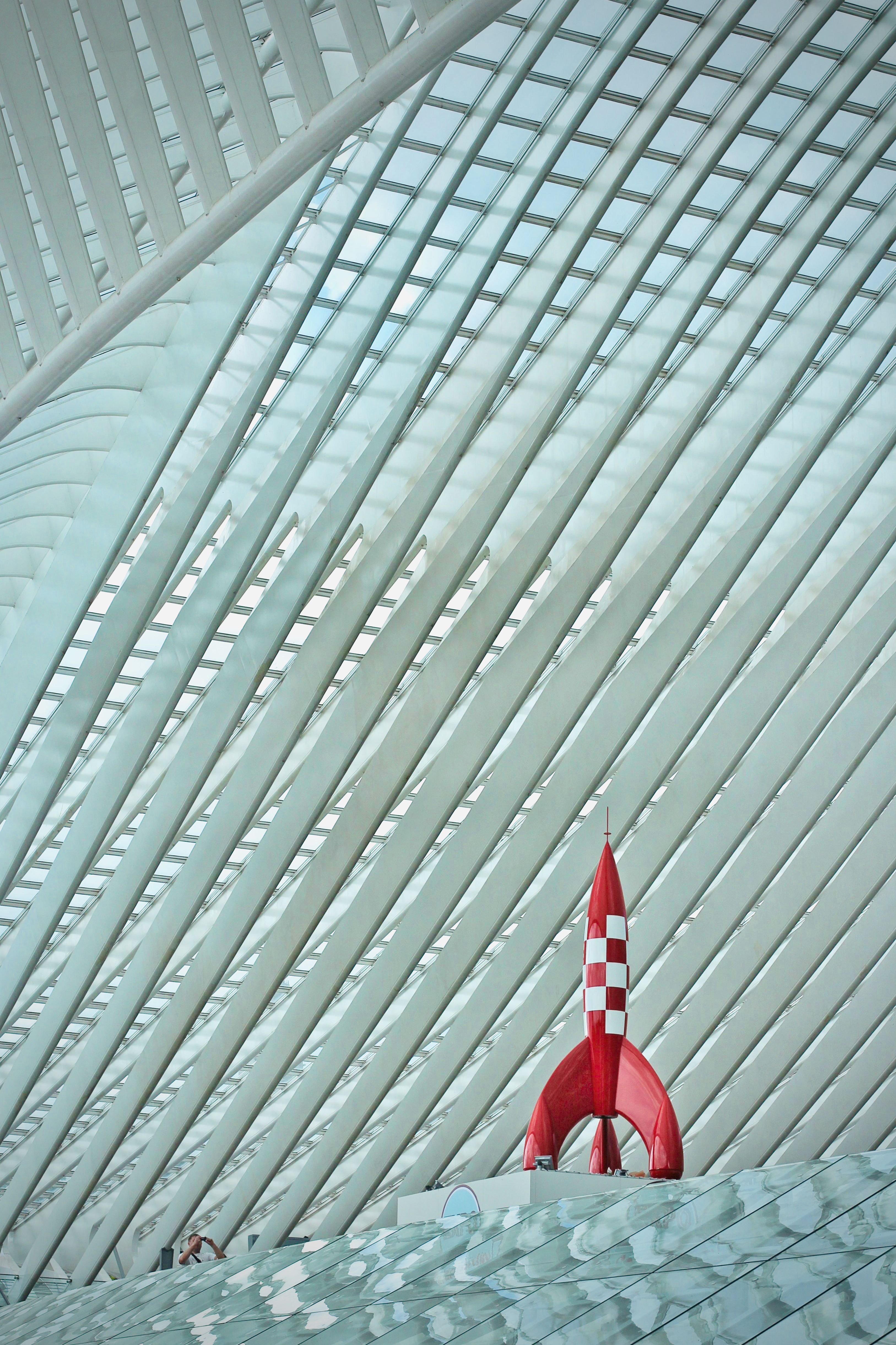 Modern Architectural Space with Red Rocket Model · Free Stock Photo