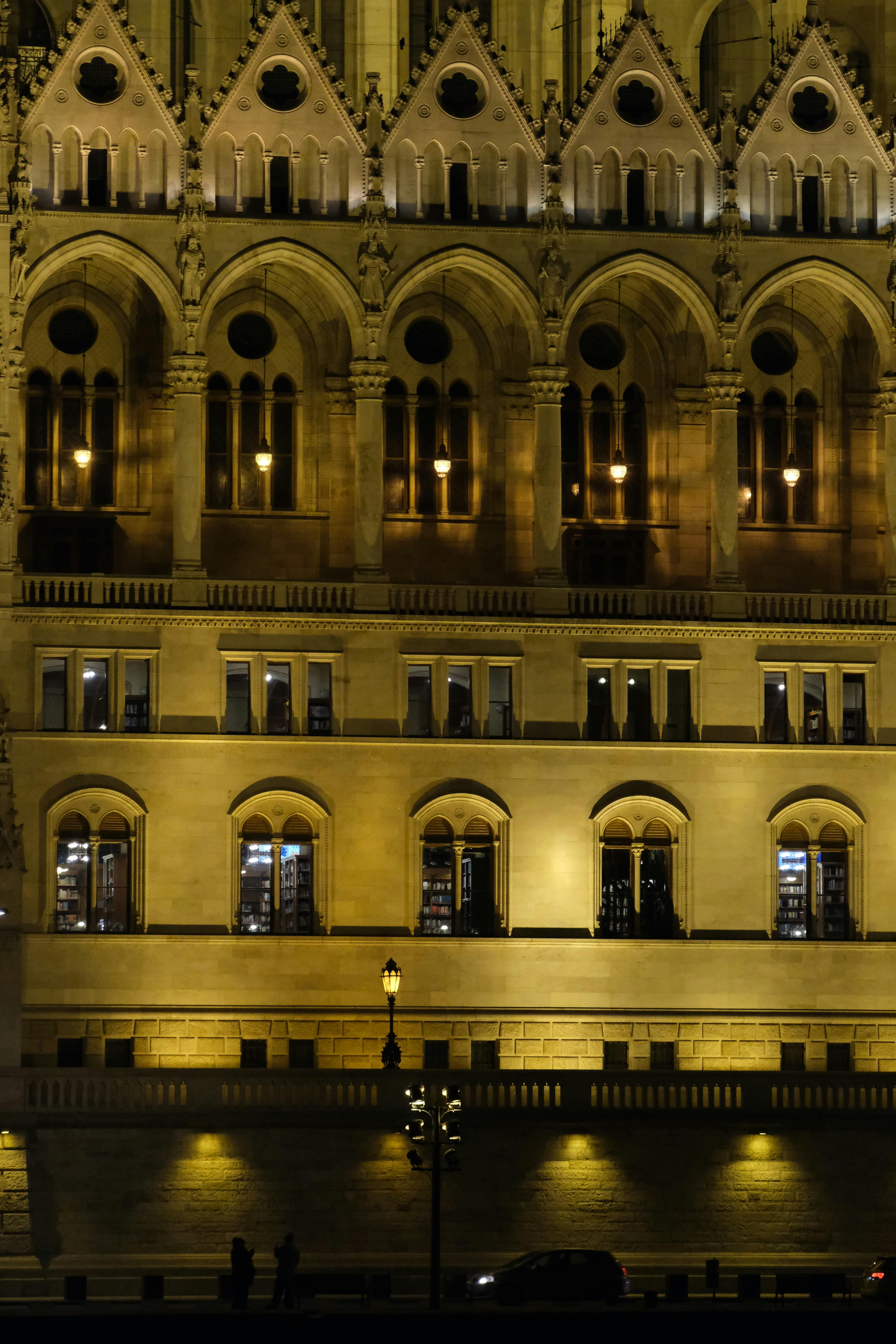 Illuminated Gothic Architecture at Night · Free Stock Photo