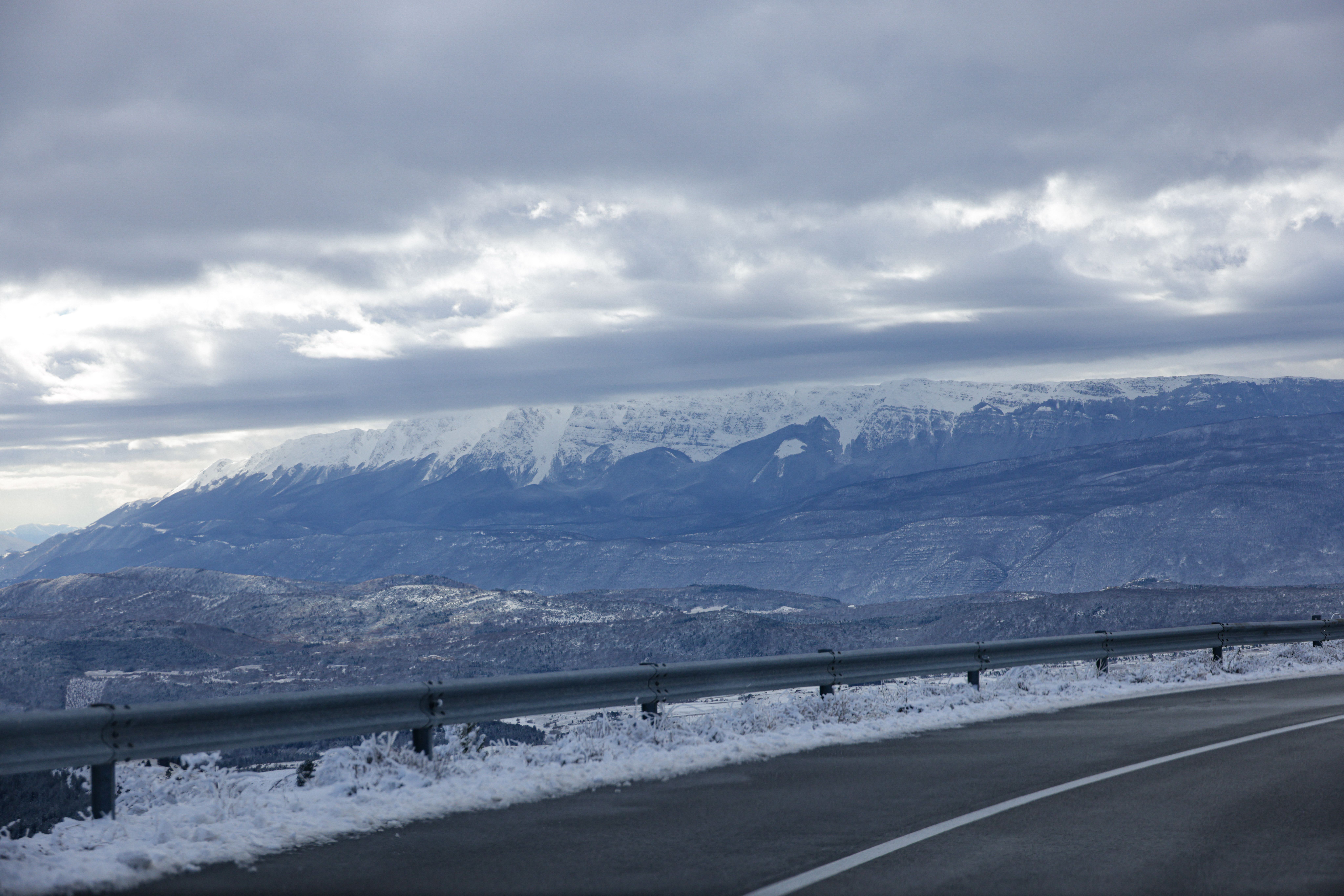 Snowy Mountain Road with Scenic Winter Views · Free Stock Photo