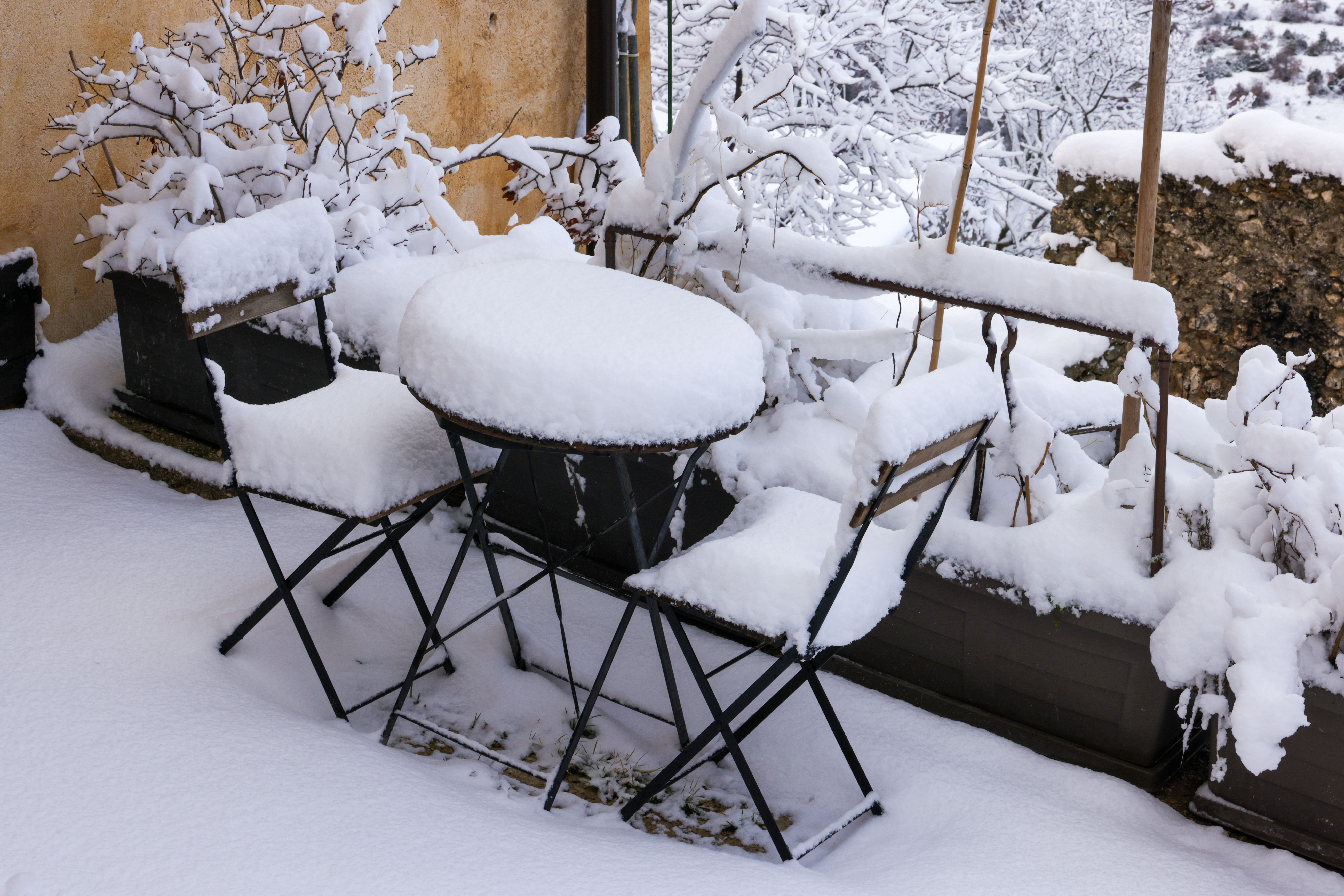 Snow-Covered Patio Furniture in a Winter Wonderland · Free Stock Photo