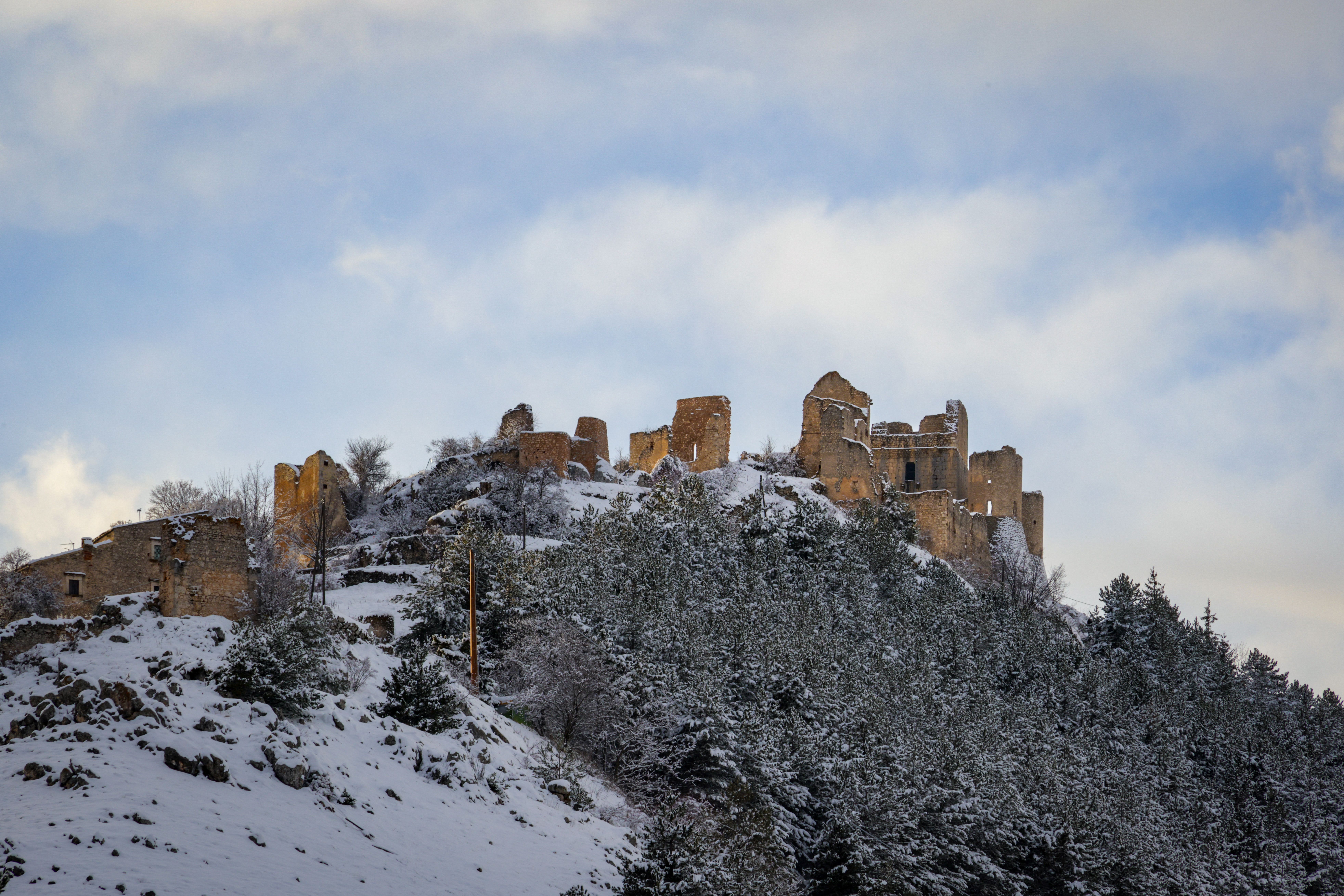 Snow-Covered Castle Ruins in Winter Landscape · Free Stock Photo