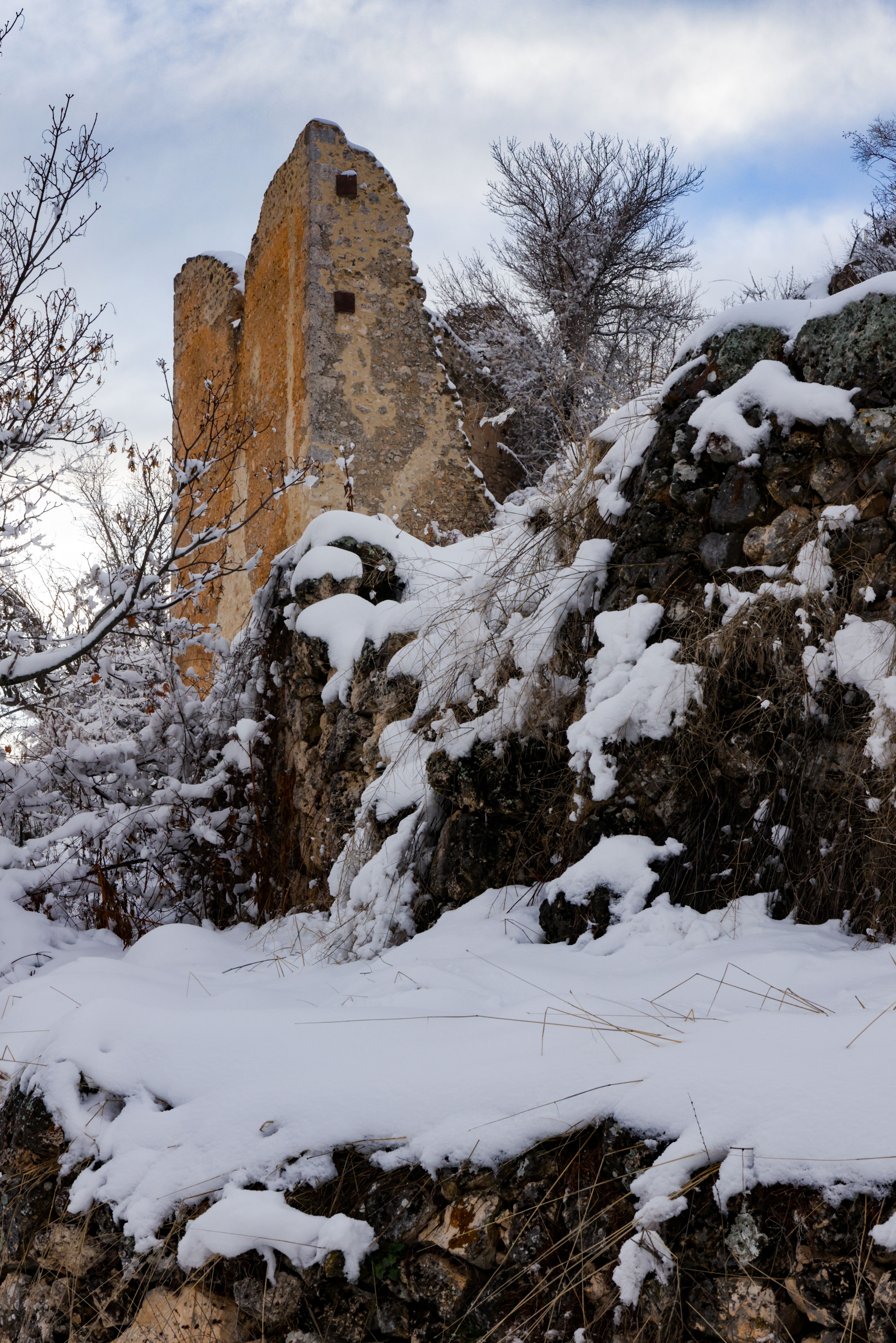 Snow-Covered Castle Ruins Amidst Winter Wonderland · Free Stock Photo