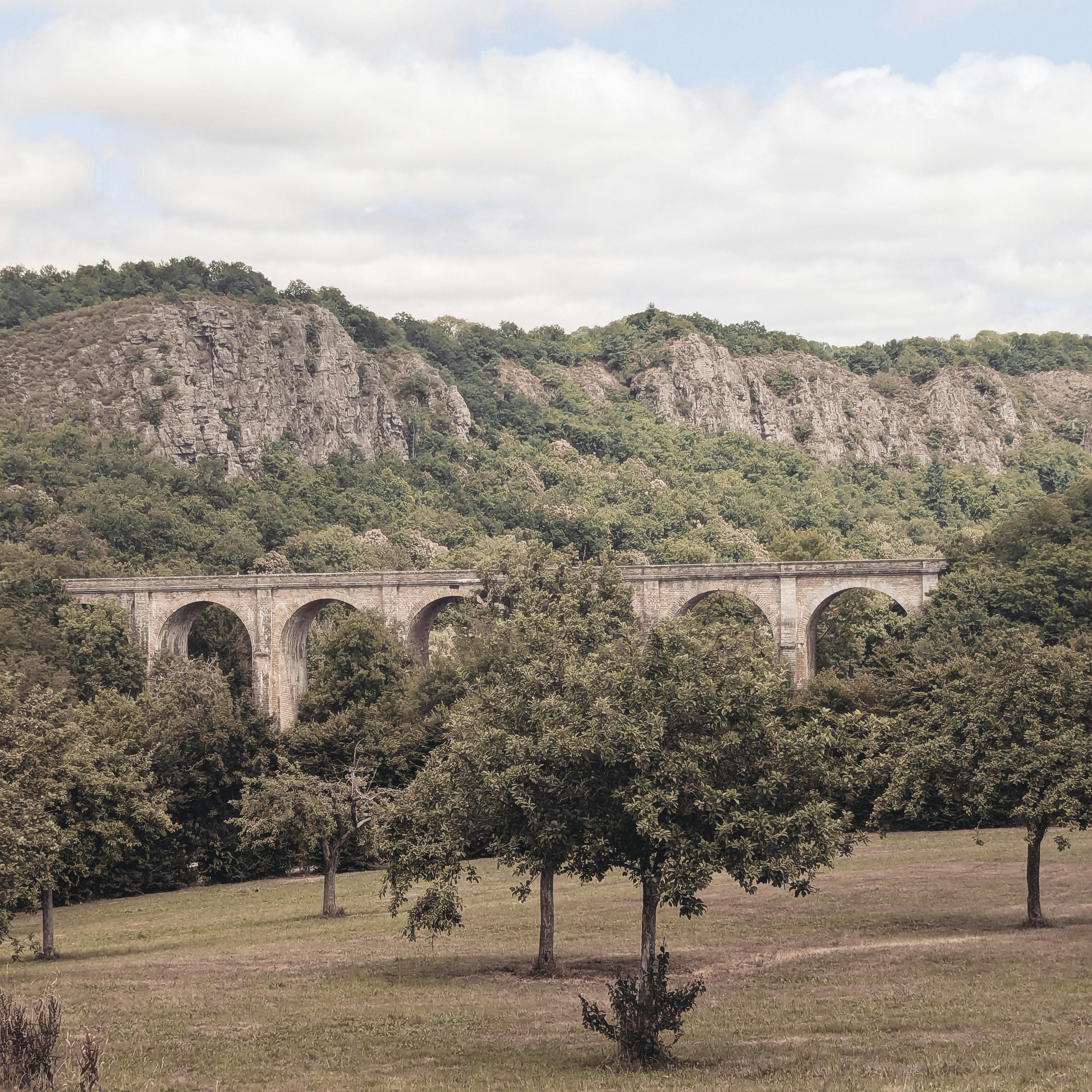 Historic Stone Viaduct in Mountainous Landscape · Free Stock Photo