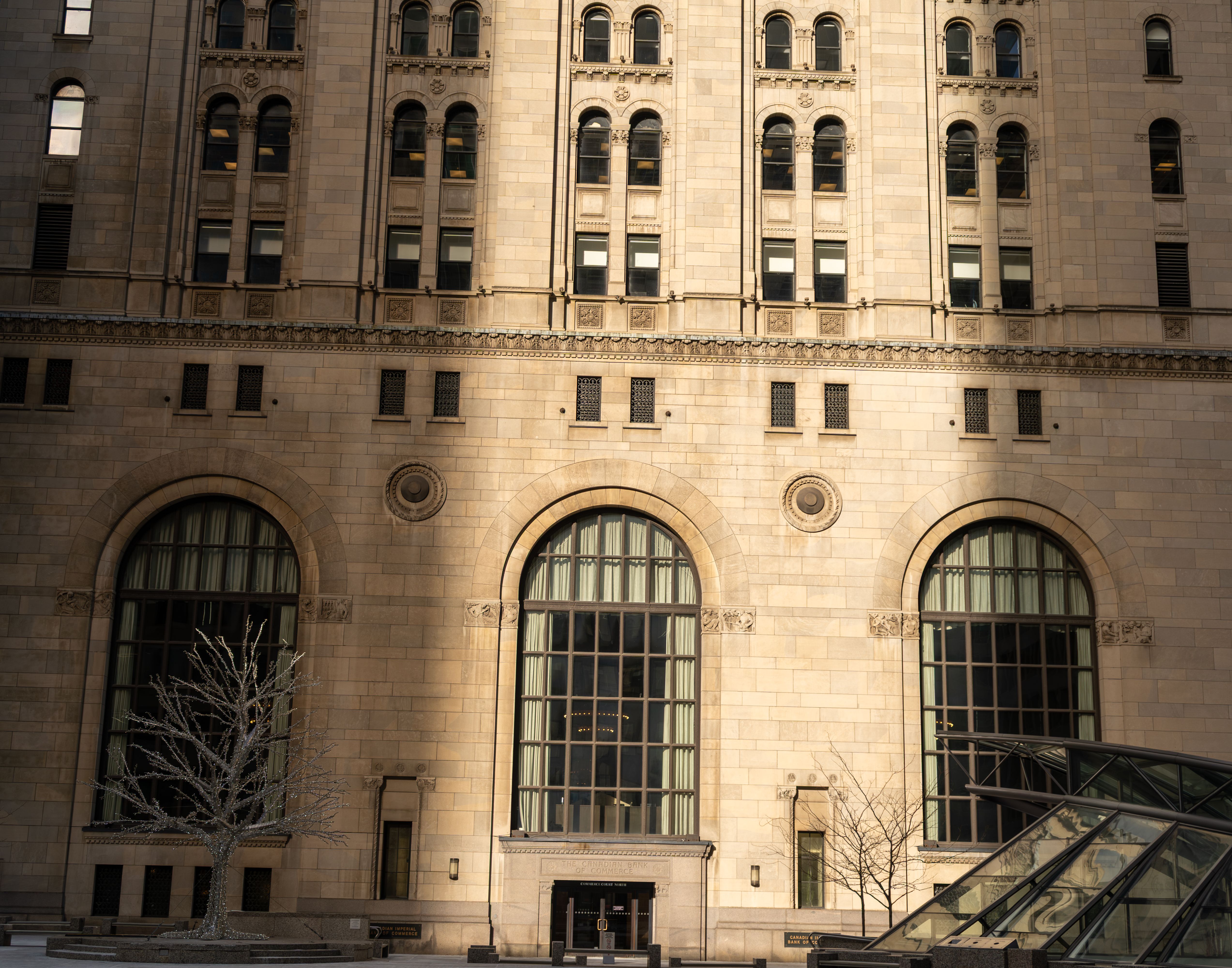 Historic building facade with large arched windows · Free Stock Photo