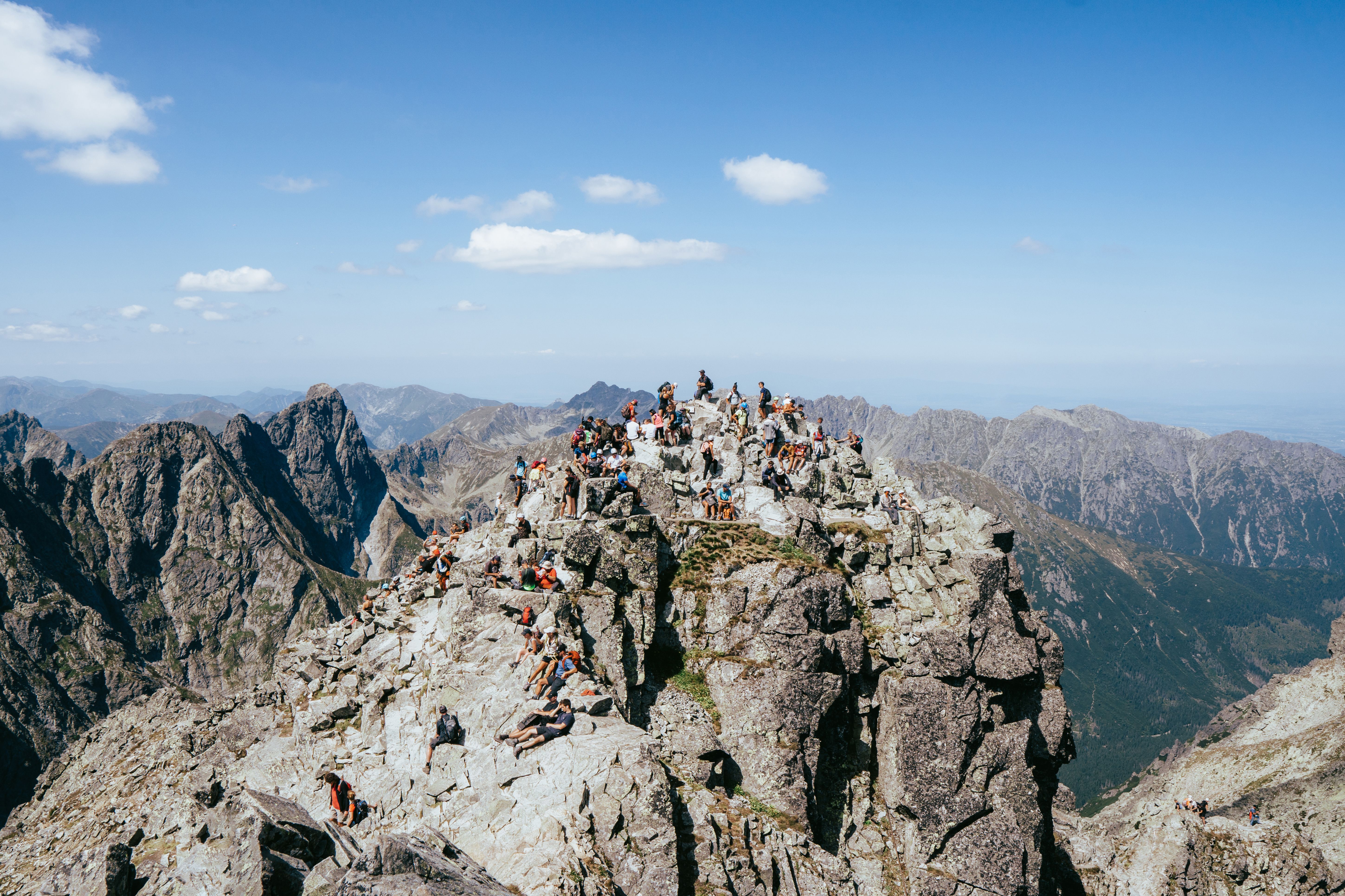 Hikers Enjoying Tatra Mountain Summit View · Free Stock Photo
