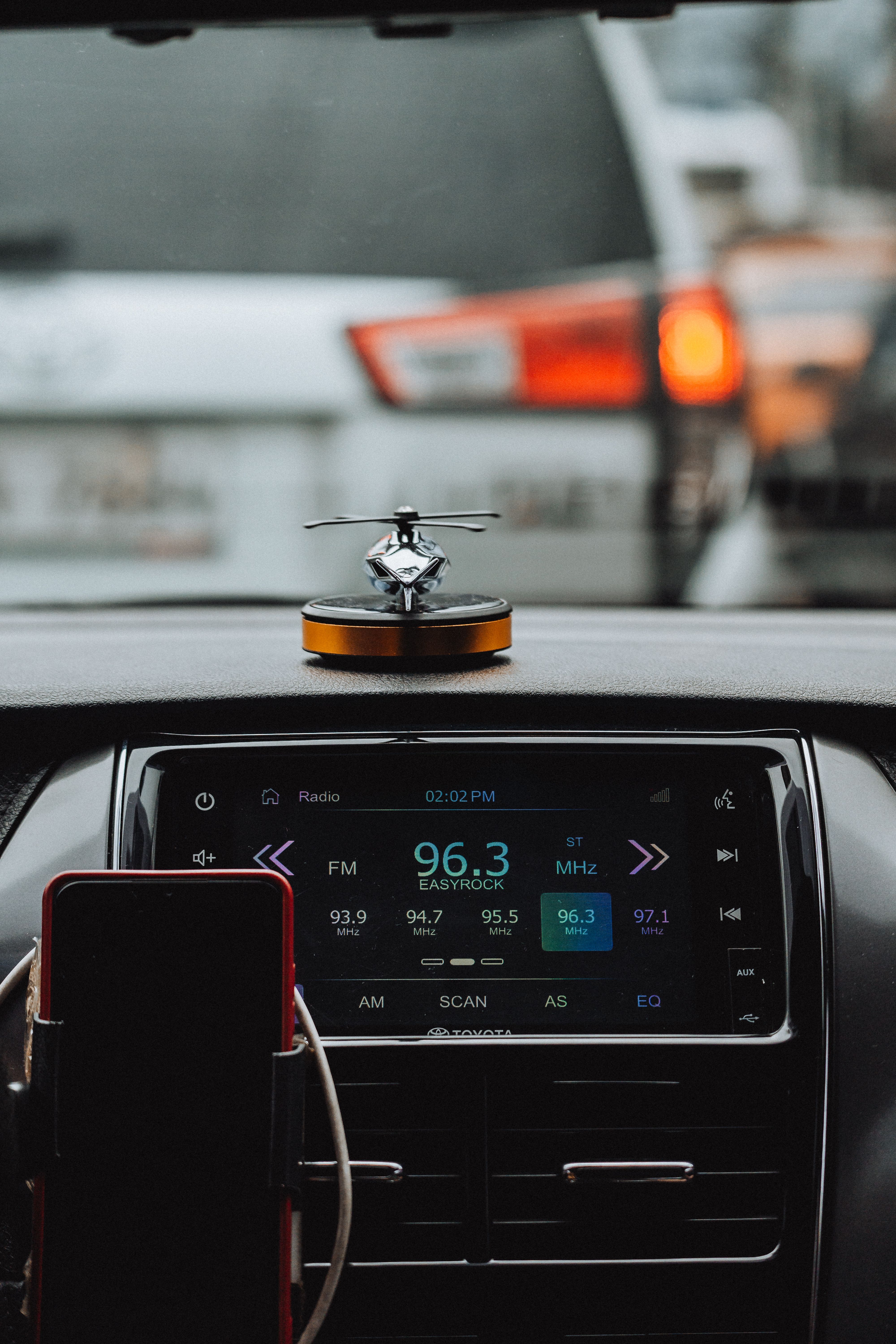 Car Dashboard with Car Radio Displaying FM Tuner · Free Stock Photo