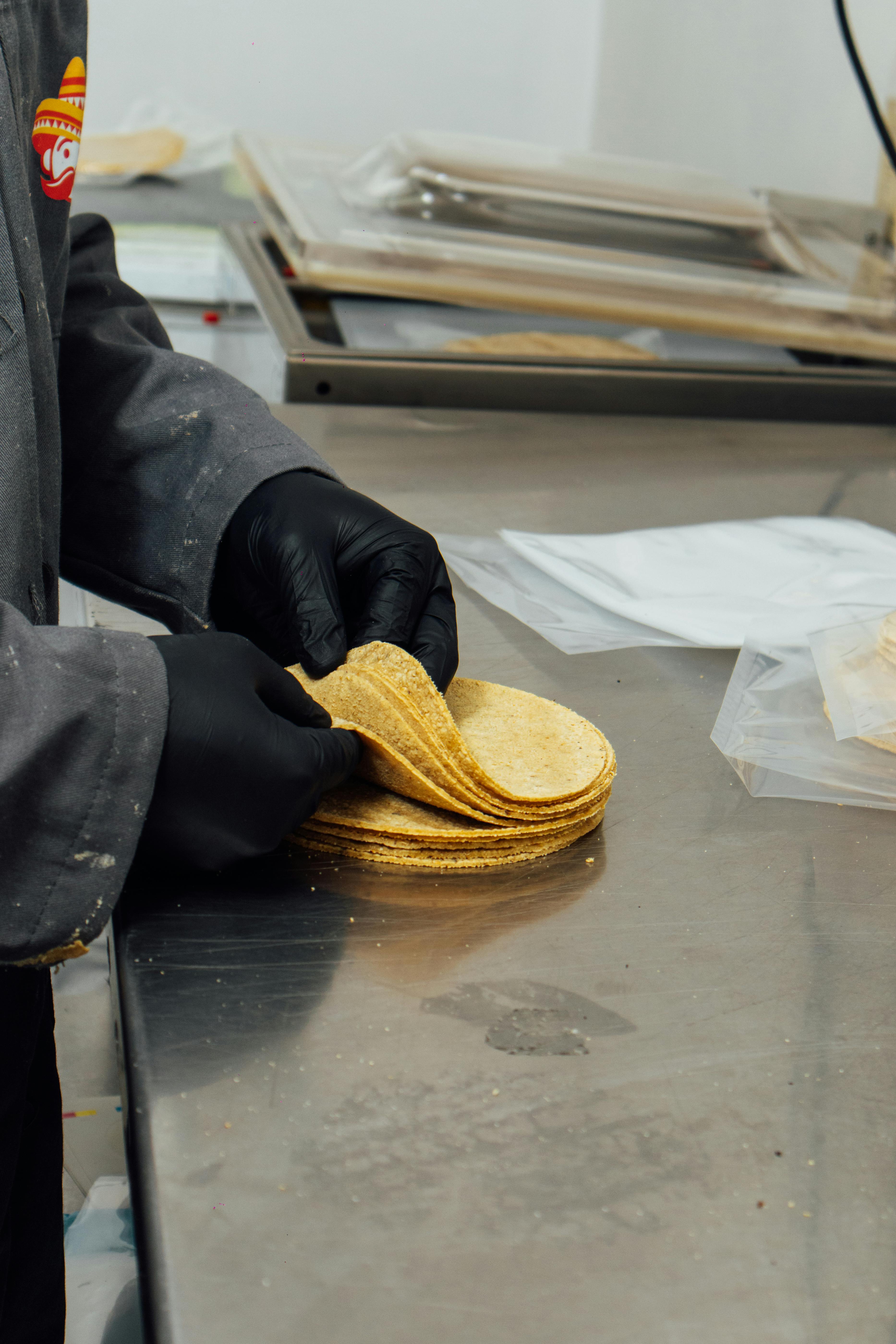 Person Preparing Fresh Corn Tortillas in Kitchen · Free Stock Photo