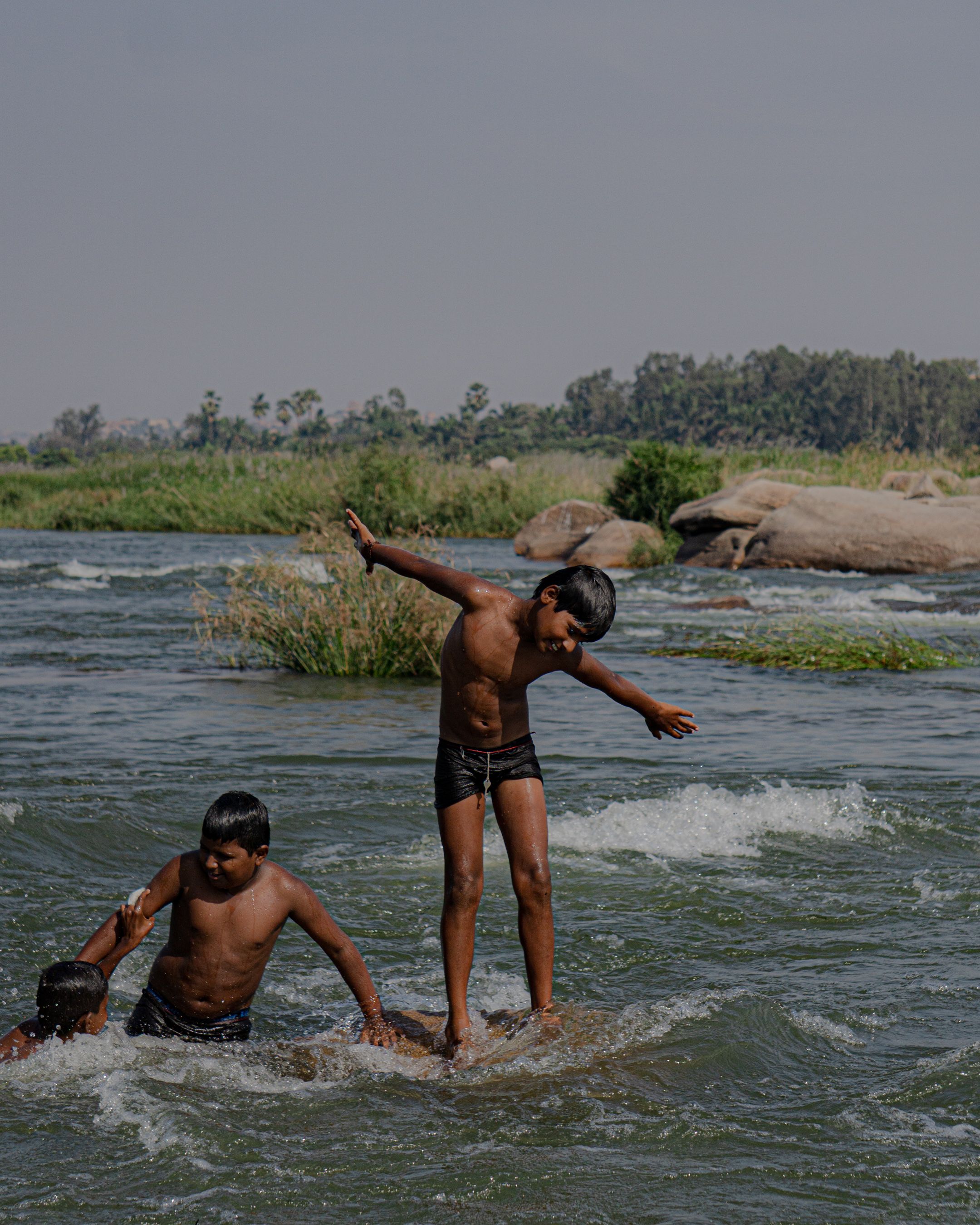 Children playing in a river on a sunny day · Free Stock Photo