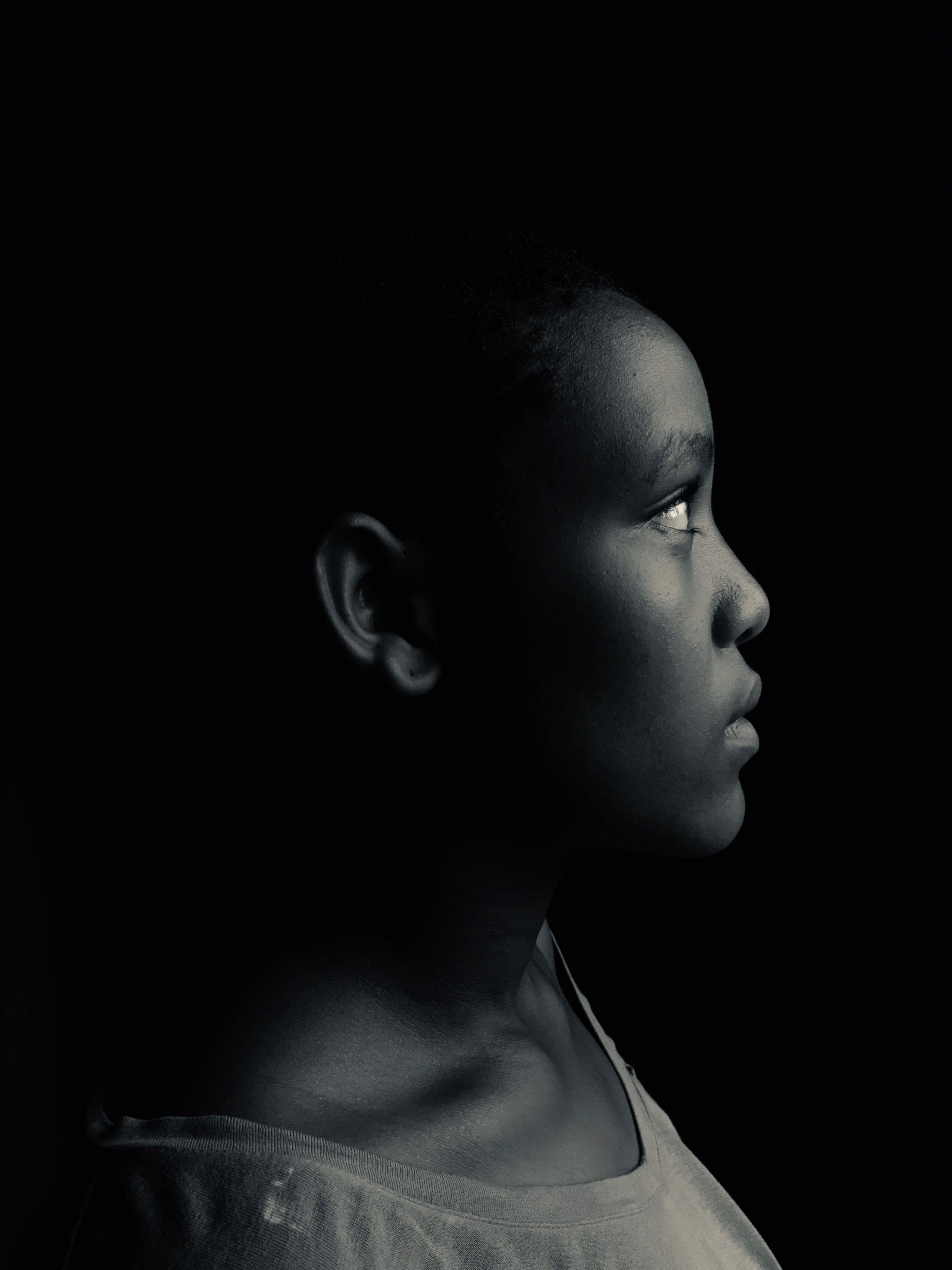 Profile Portrait of Woman in Dramatic Lighting · Free Stock Photo