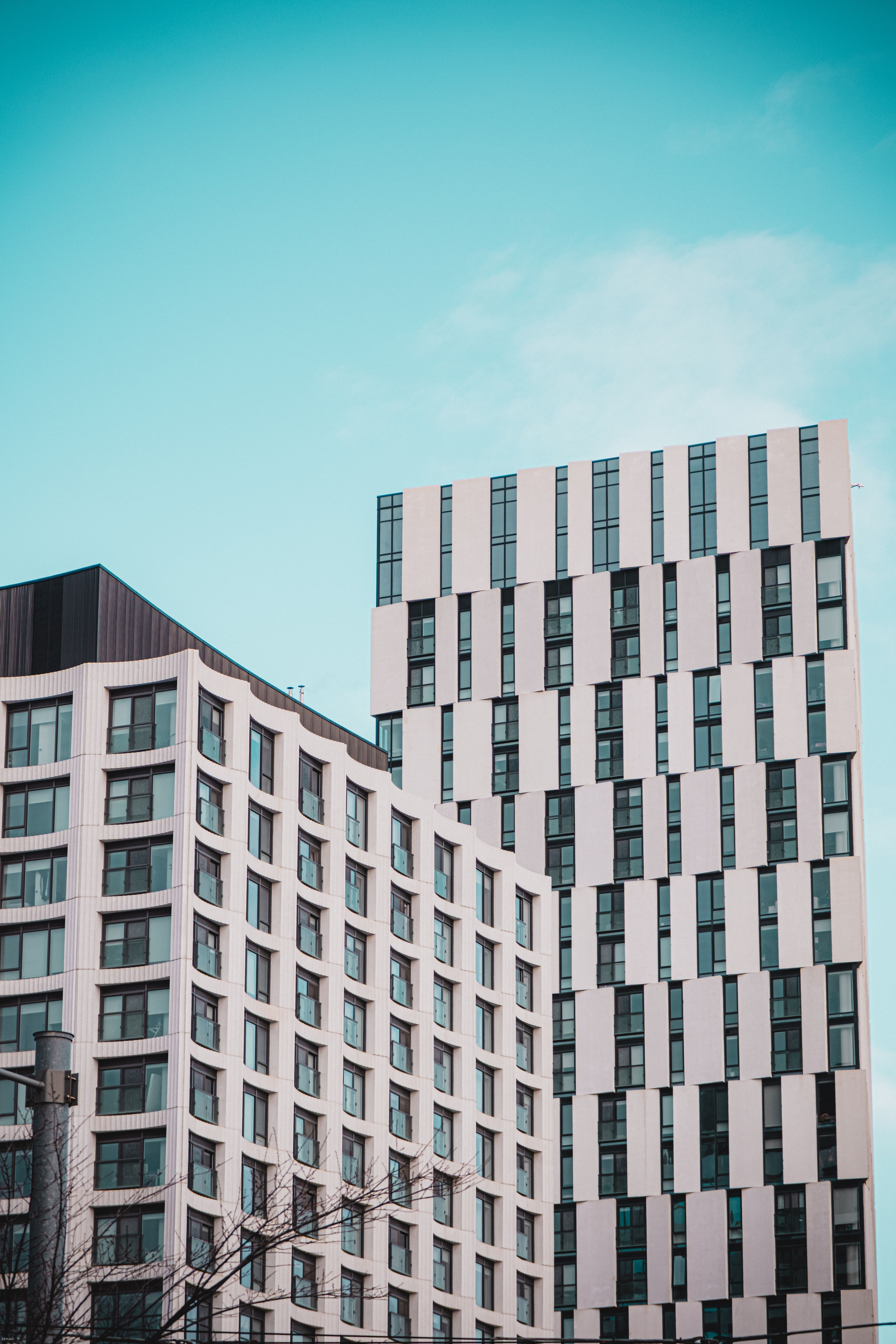 Modern High-Rise Buildings Against Blue Sky · Free Stock Photo