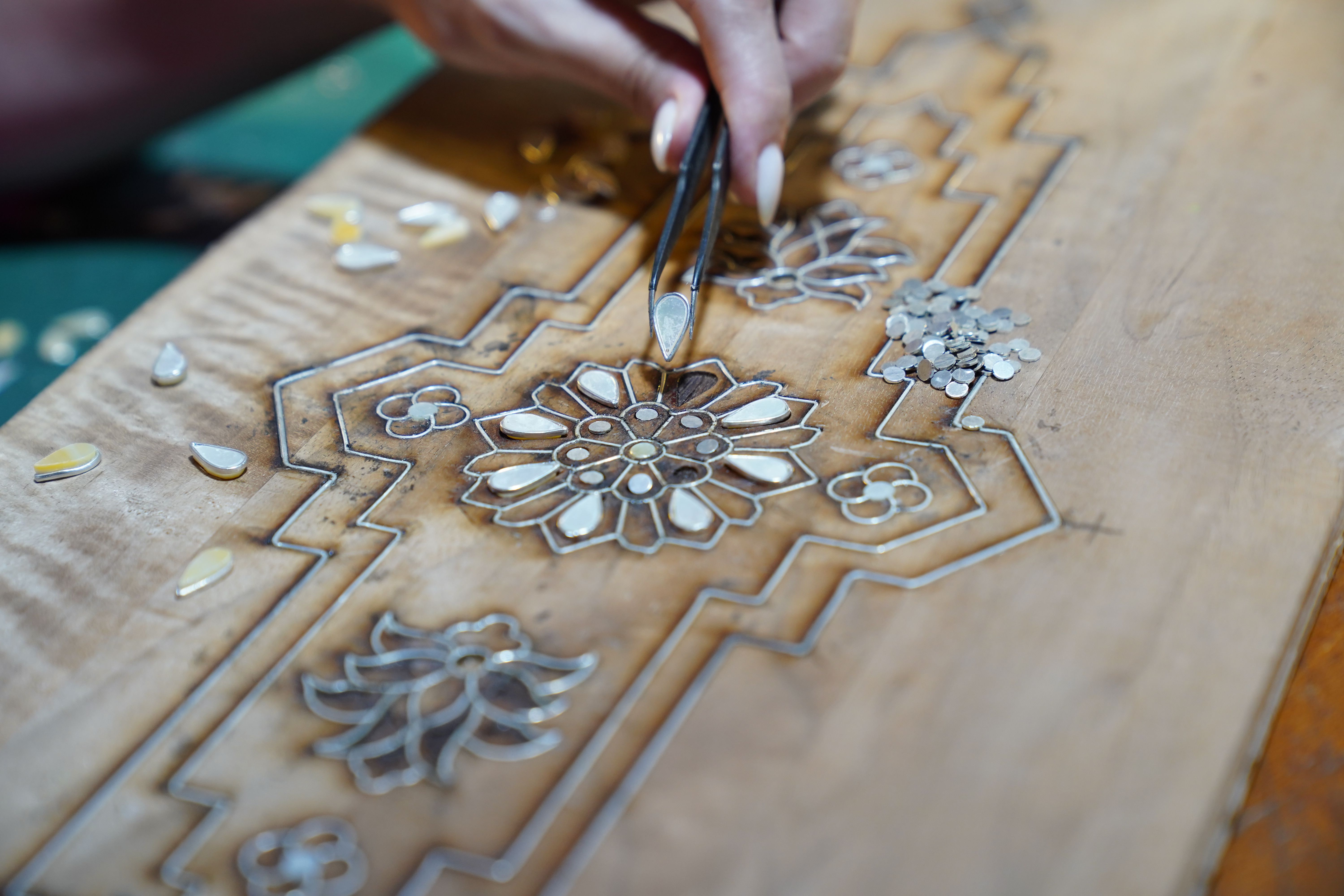 Artisan Crafting Intricate Wood Inlay Design · Free Stock Photo