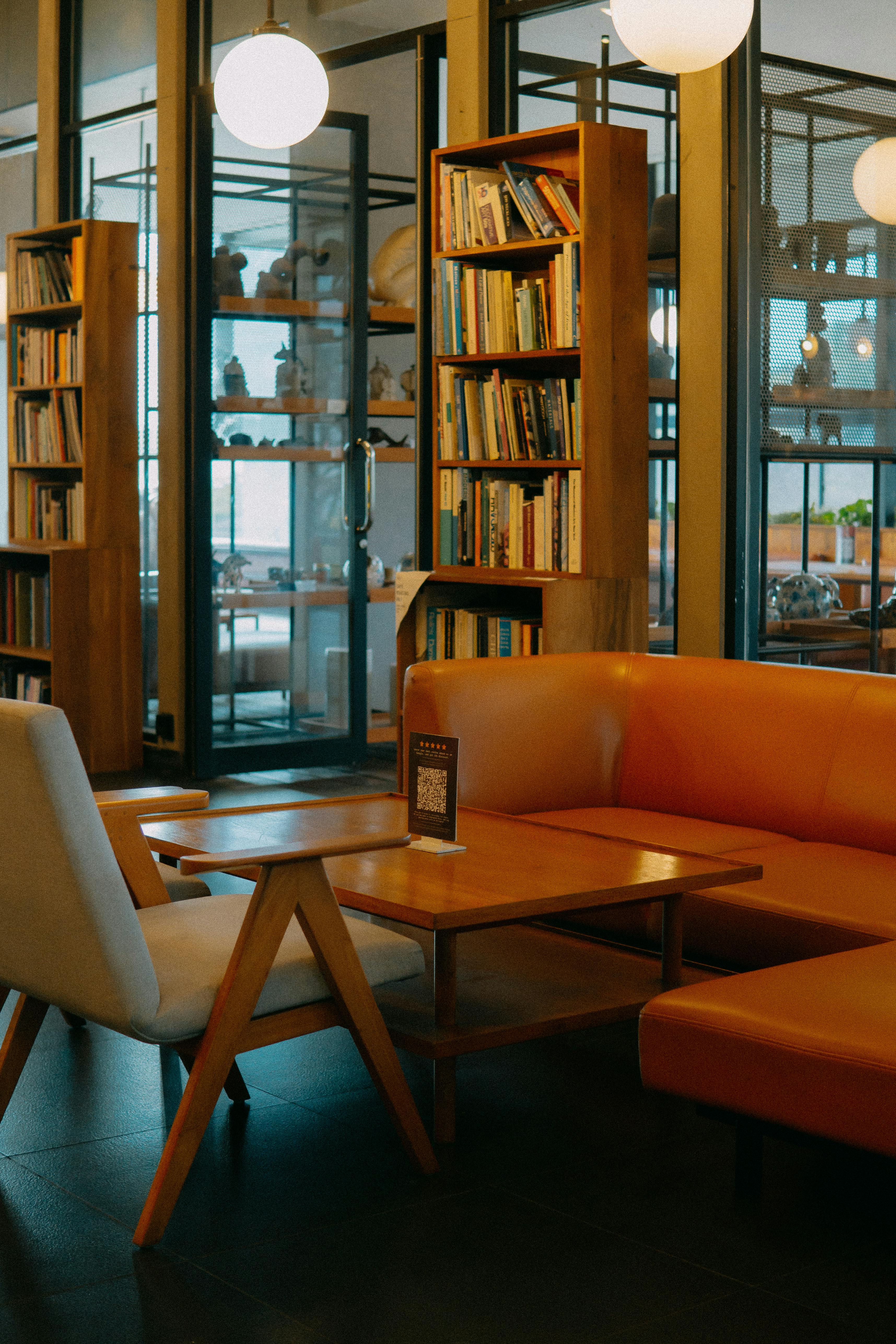 Cozy Reading Nook in Modern Cafe Library · Free Stock Photo
