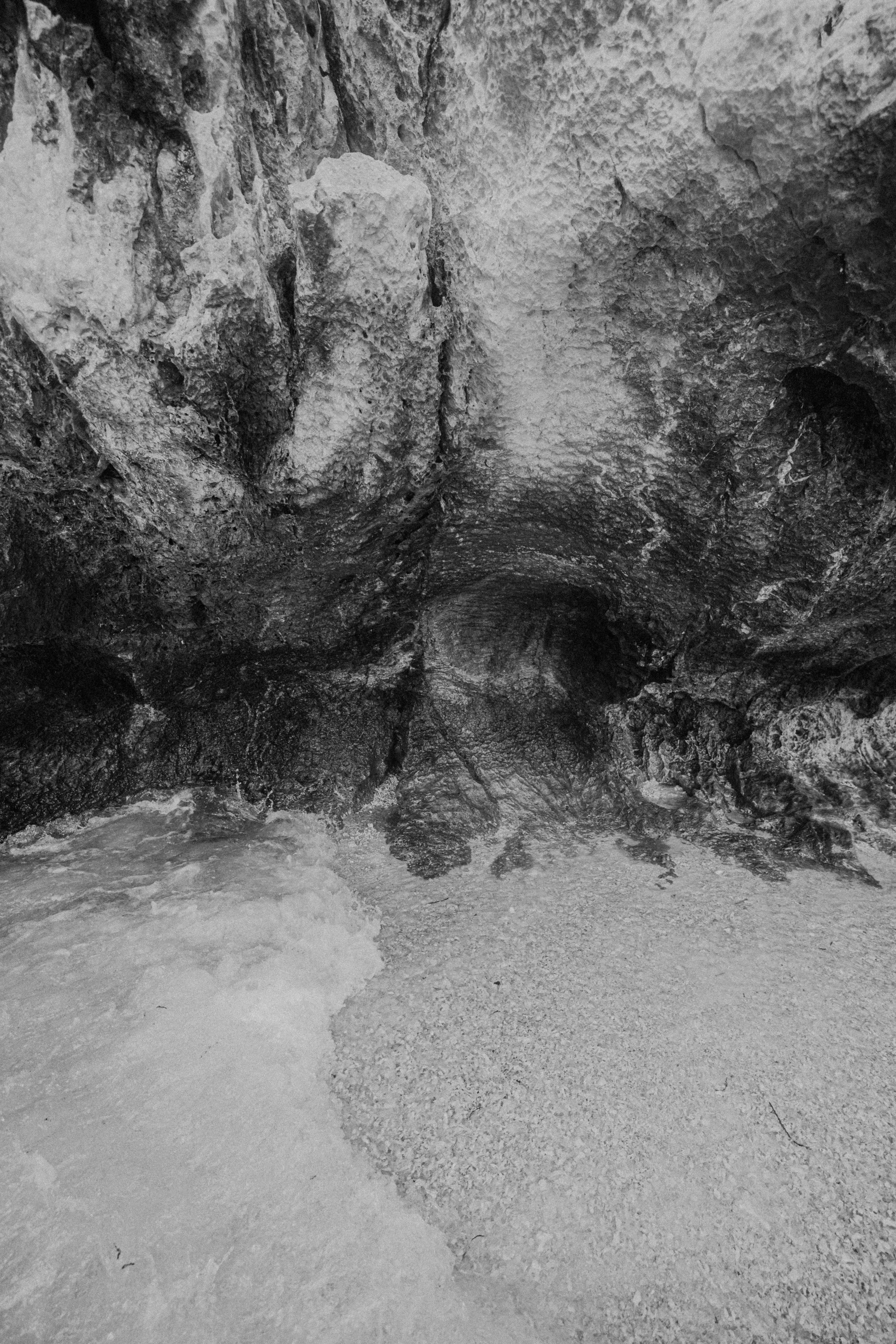 Monochrome Rocky Beach Cave Entrance · Free Stock Photo