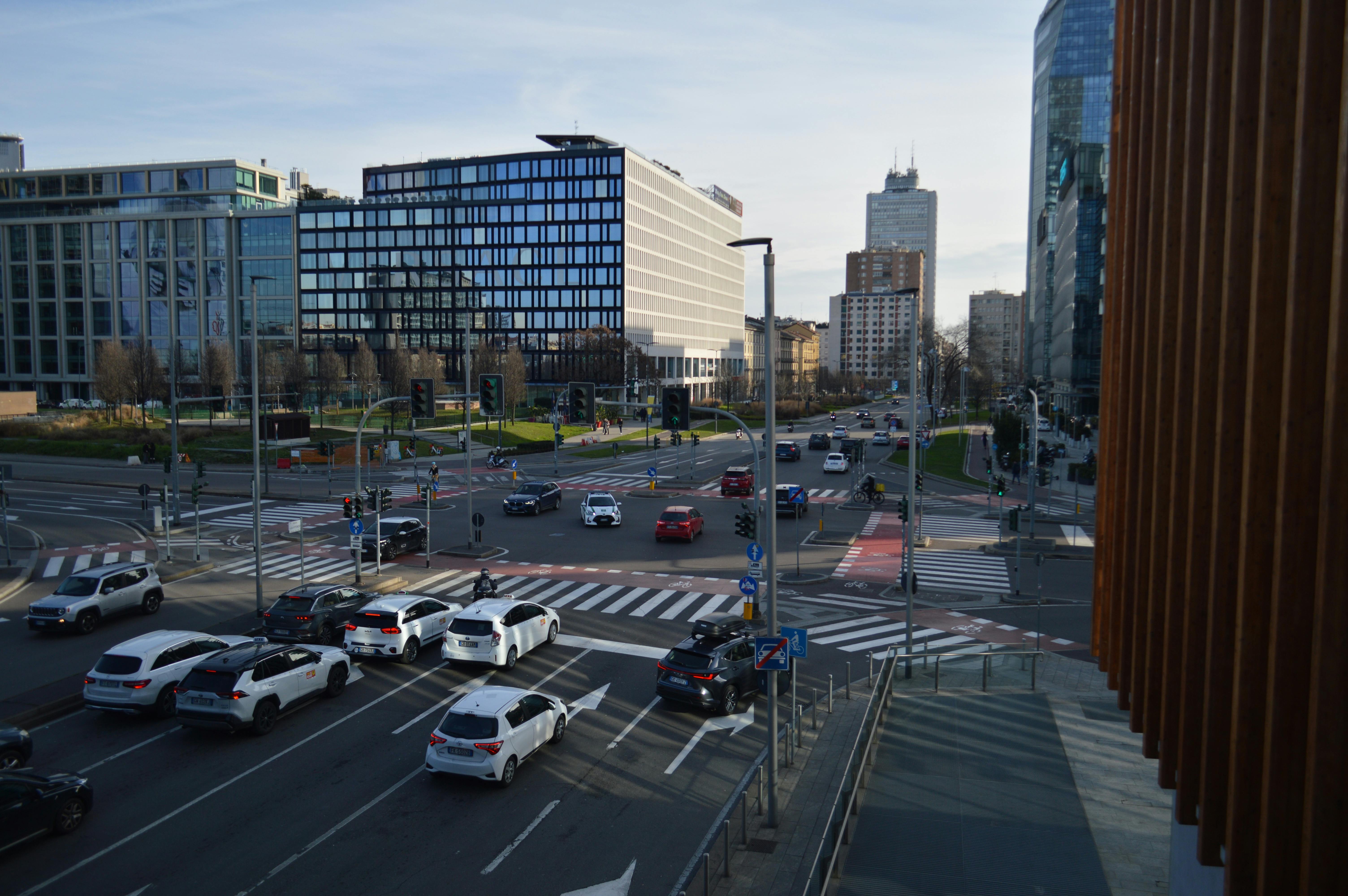 Busy Urban Intersection with Modern Buildings · Free Stock Photo