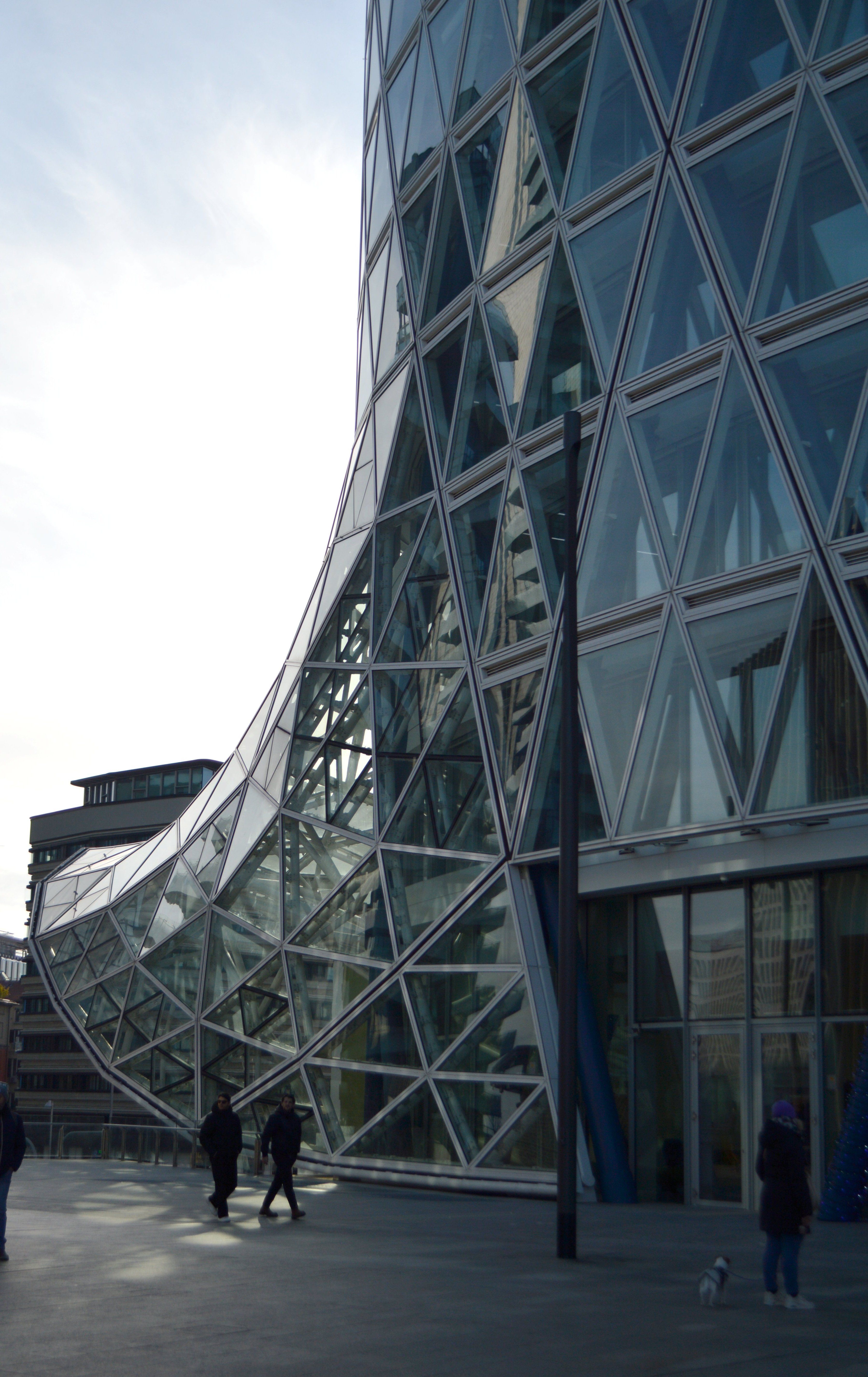 Modern Architectural Glass Facade in Urban Setting · Free Stock Photo