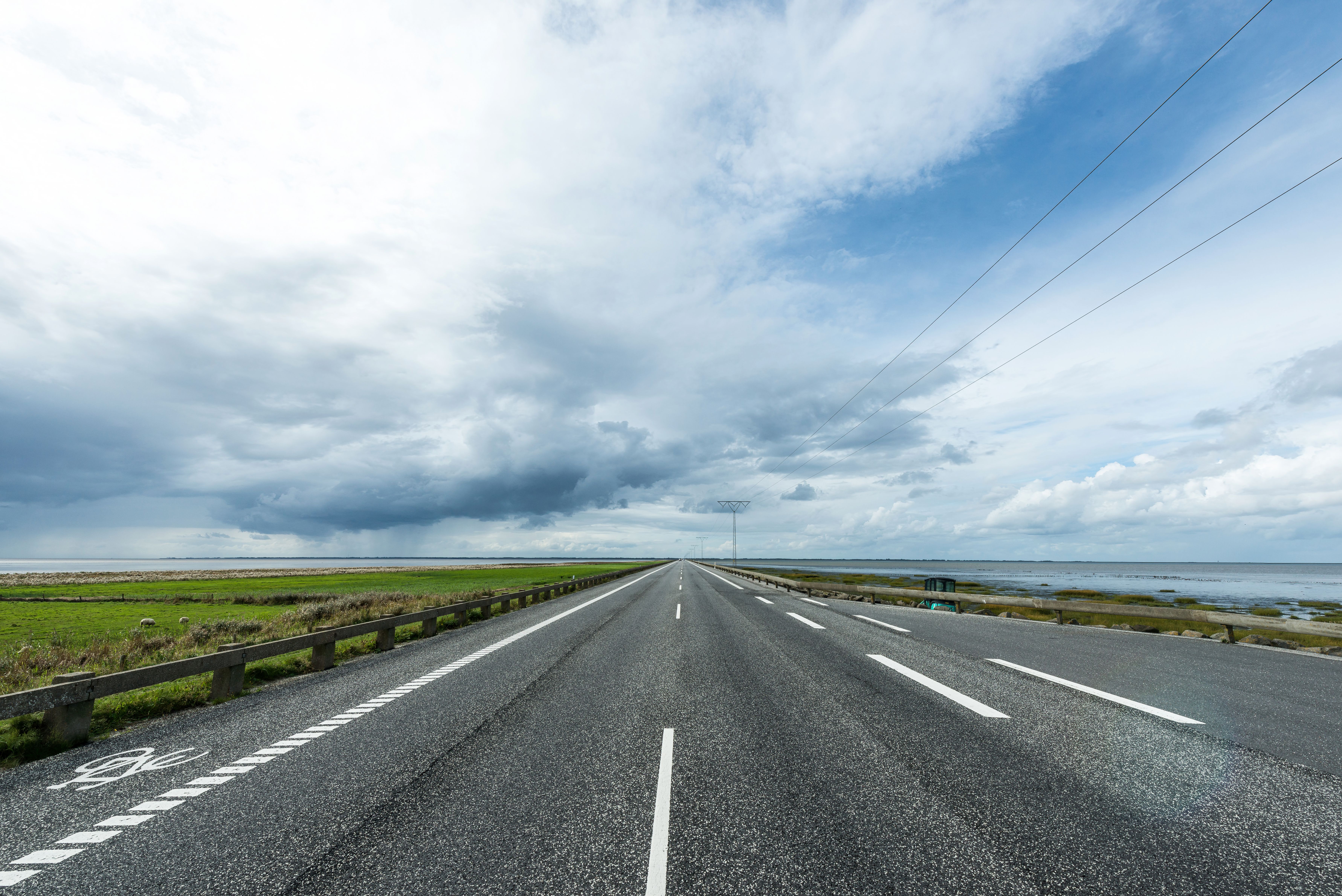 Scenic Coastal Road in Denmark with Endless Horizon · Free Stock Photo