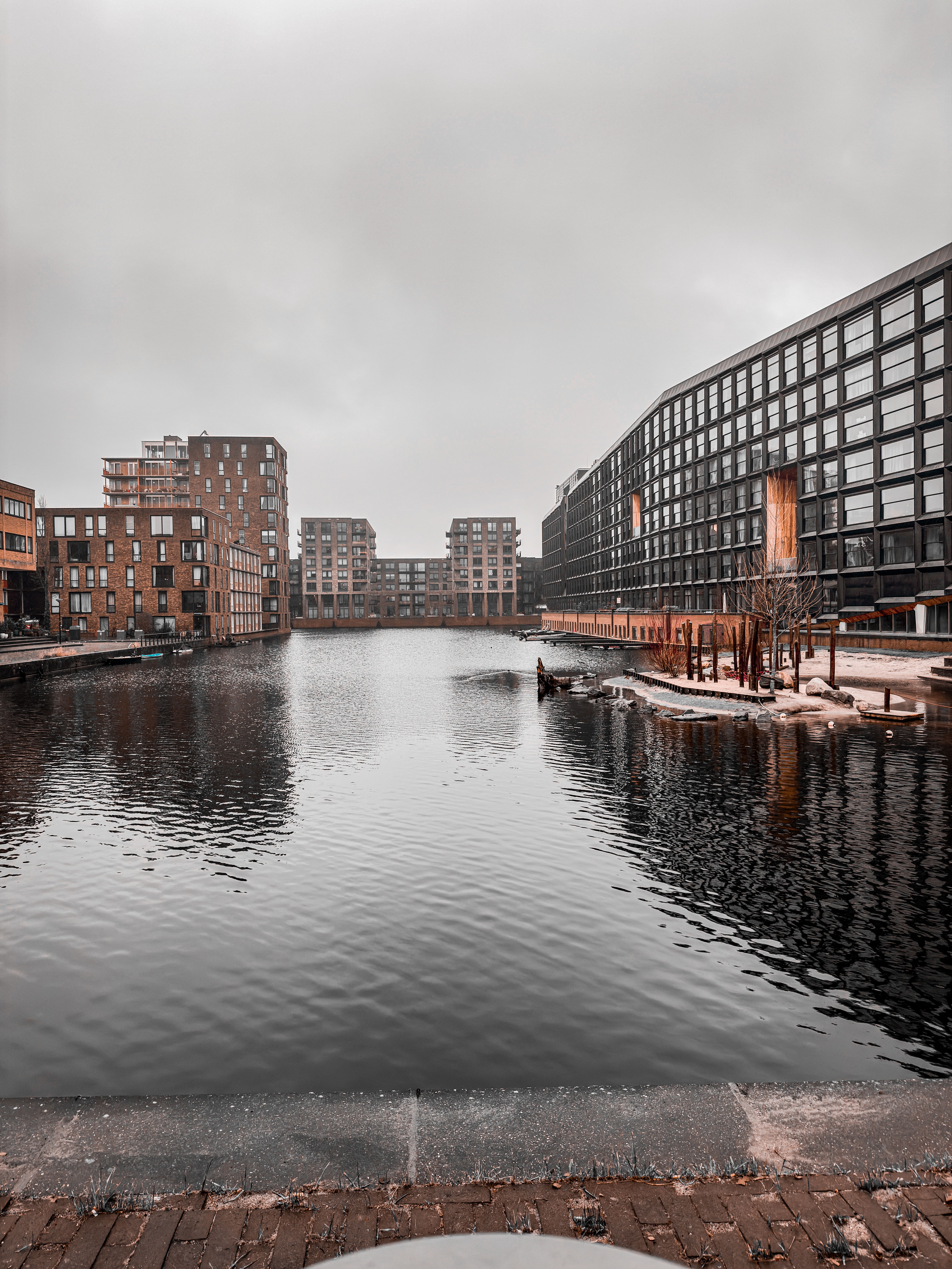 Modern Waterfront Architecture in Urban Setting · Free Stock Photo