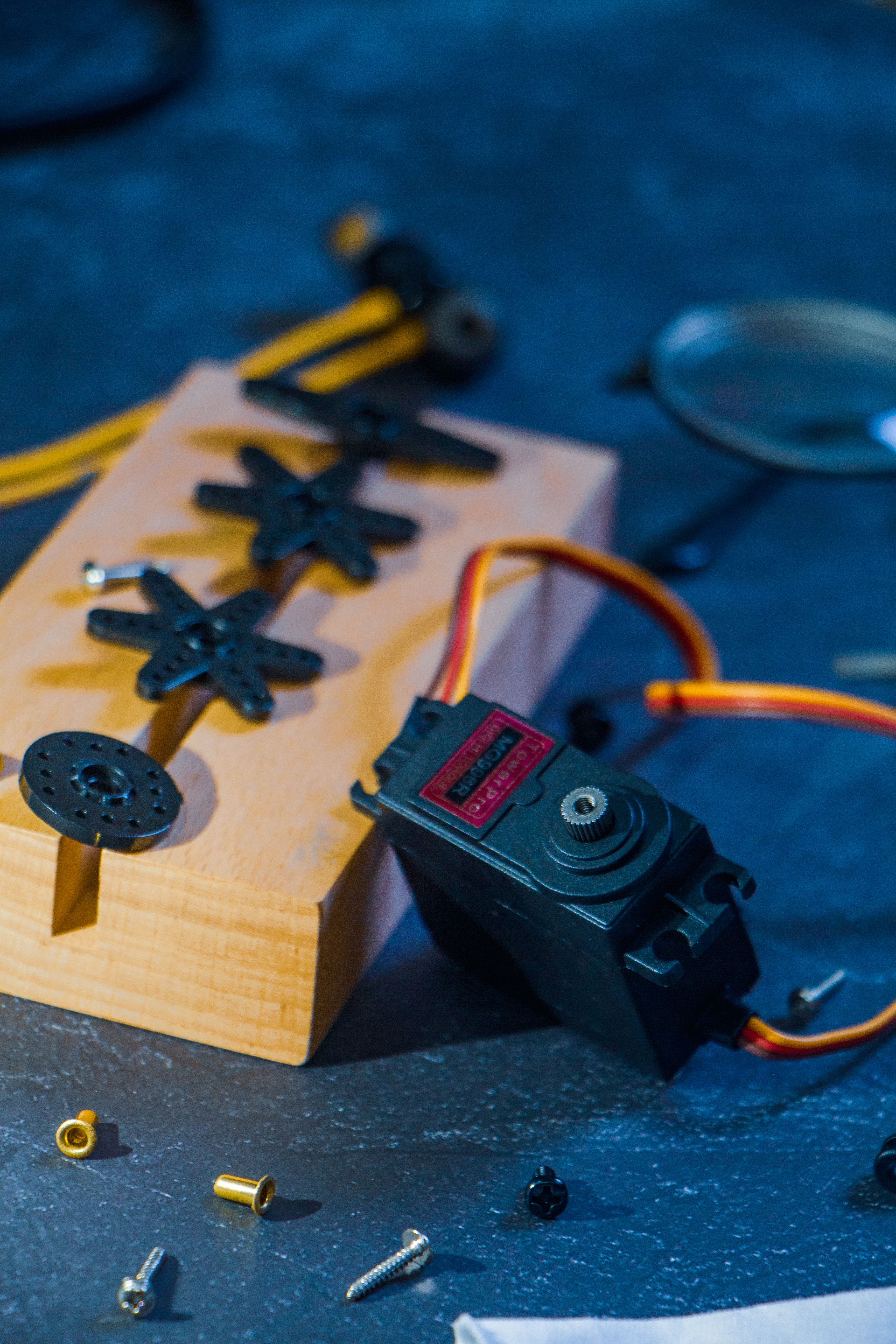 Robotics Kit Components on Workshop Table · Free Stock Photo