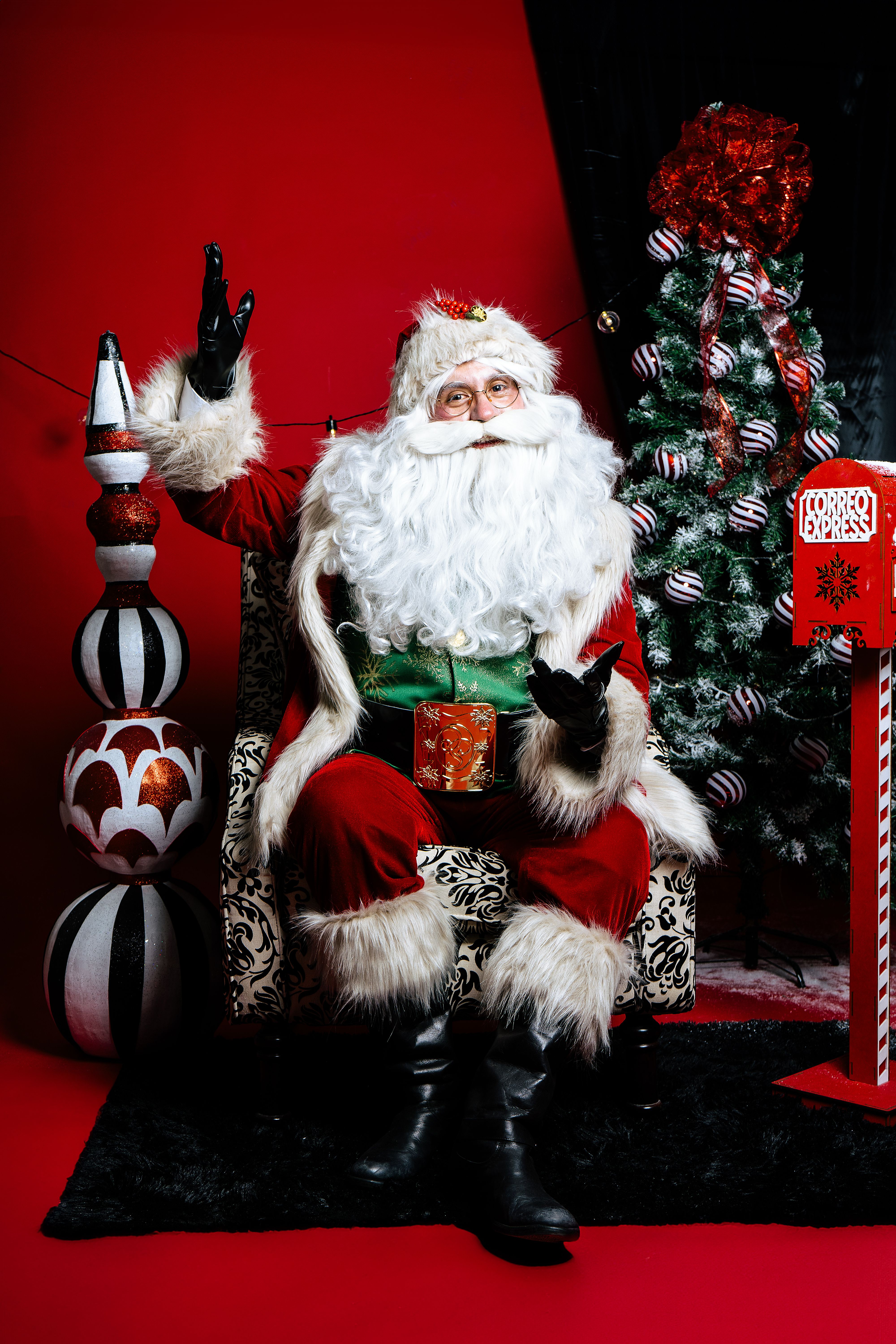 Festive Santa Claus with Christmas Tree and Decorations · Free Stock Photo