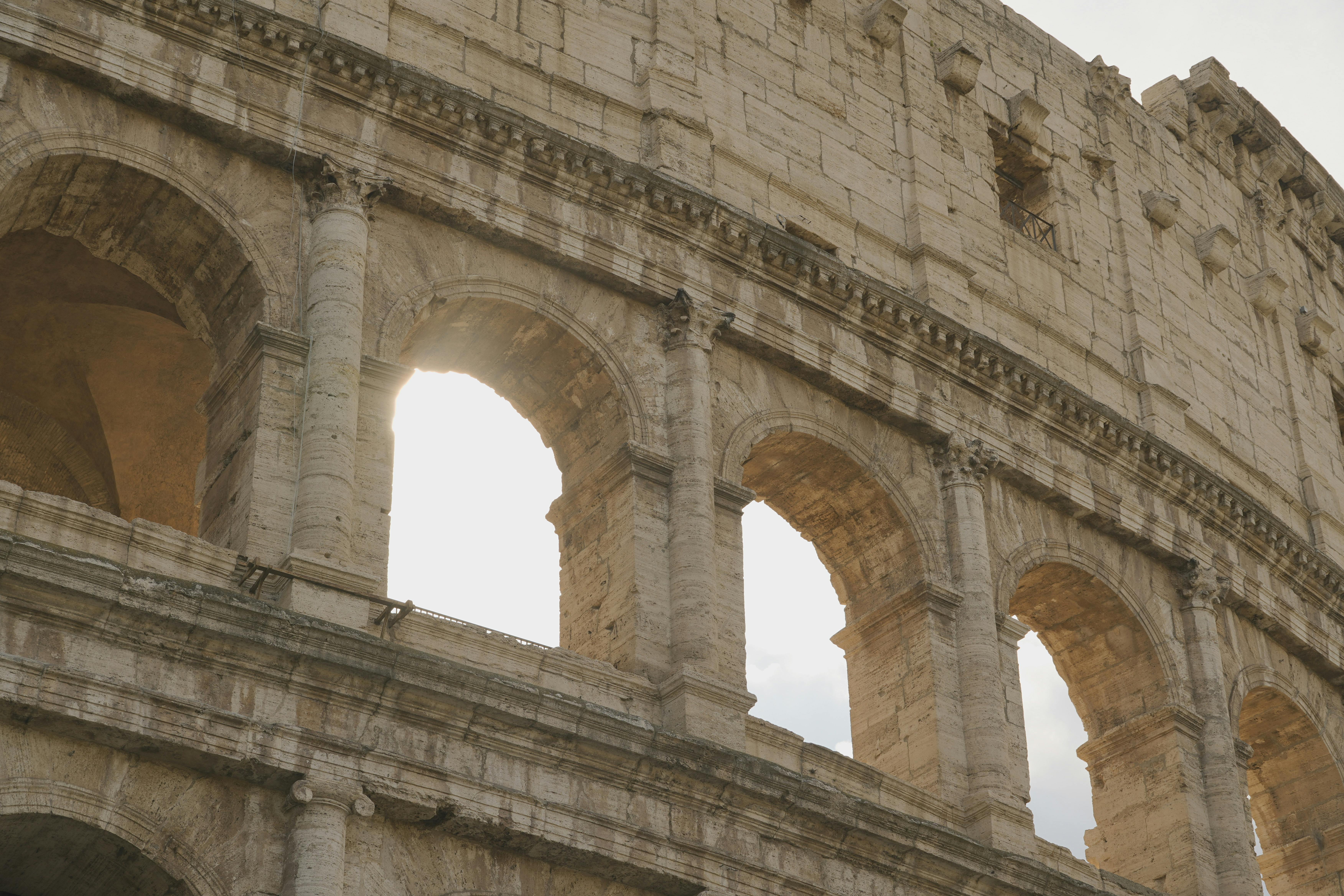Historic Colosseum Arches in Rome at Daylight · Free Stock Photo