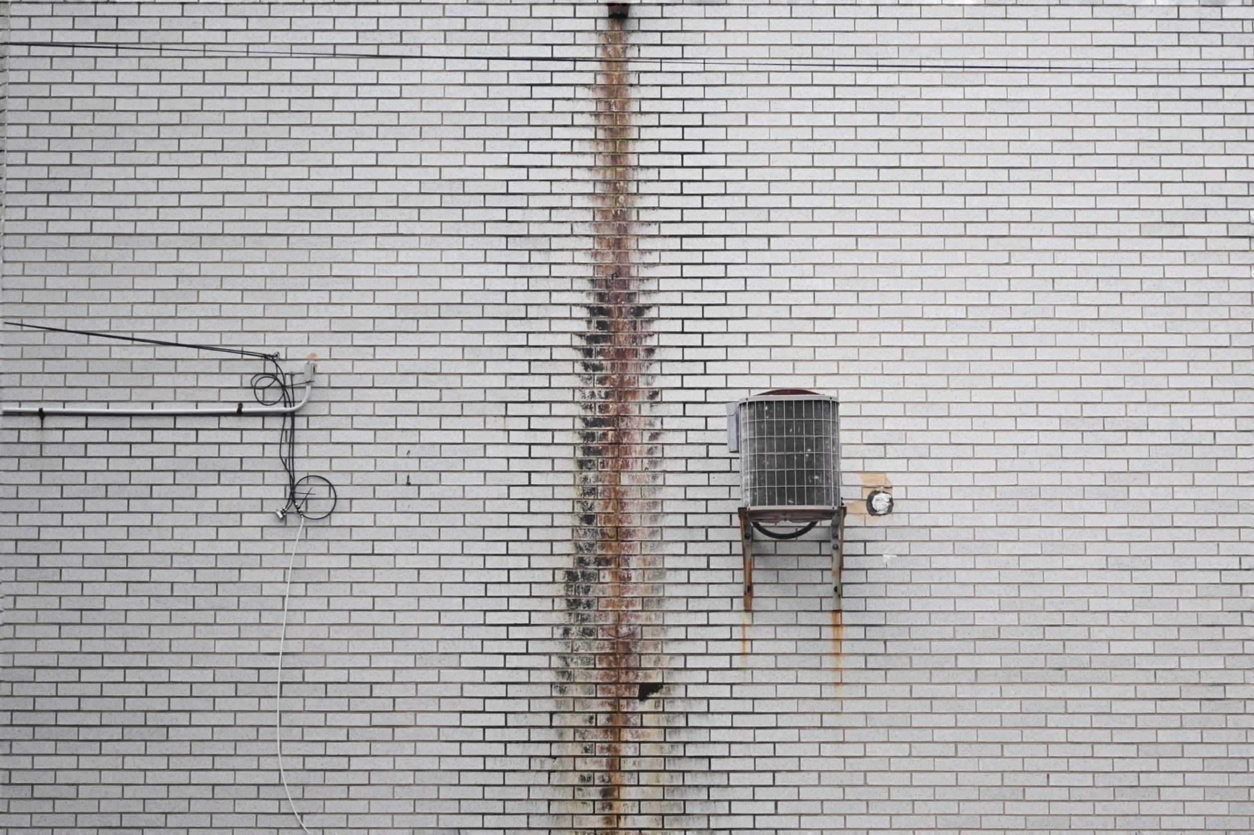 Rusty Air Conditioning Unit on Brick Wall · Free Stock Photo