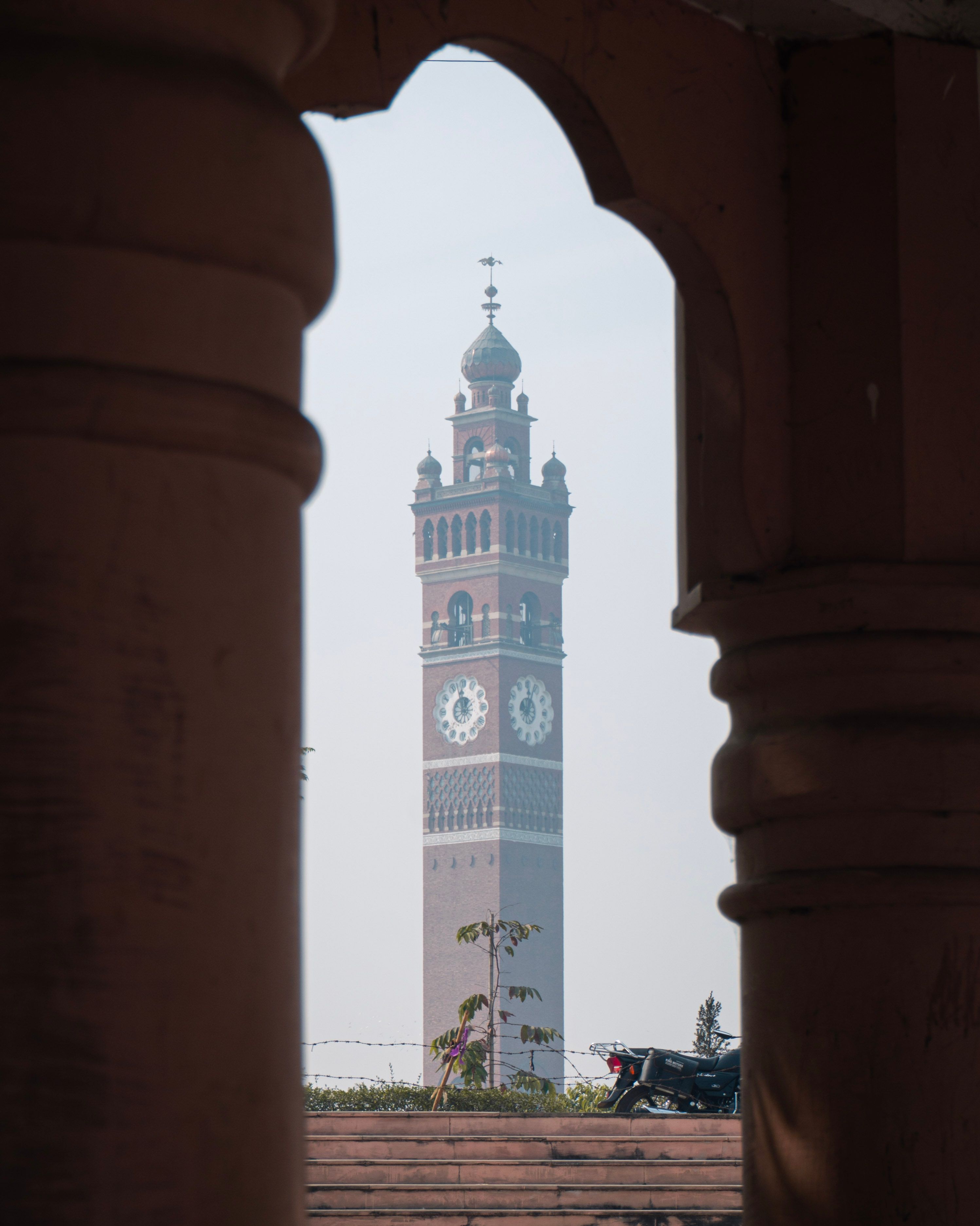 Historic Clock Tower Framed by Arches in Lucknow · Free Stock Photo