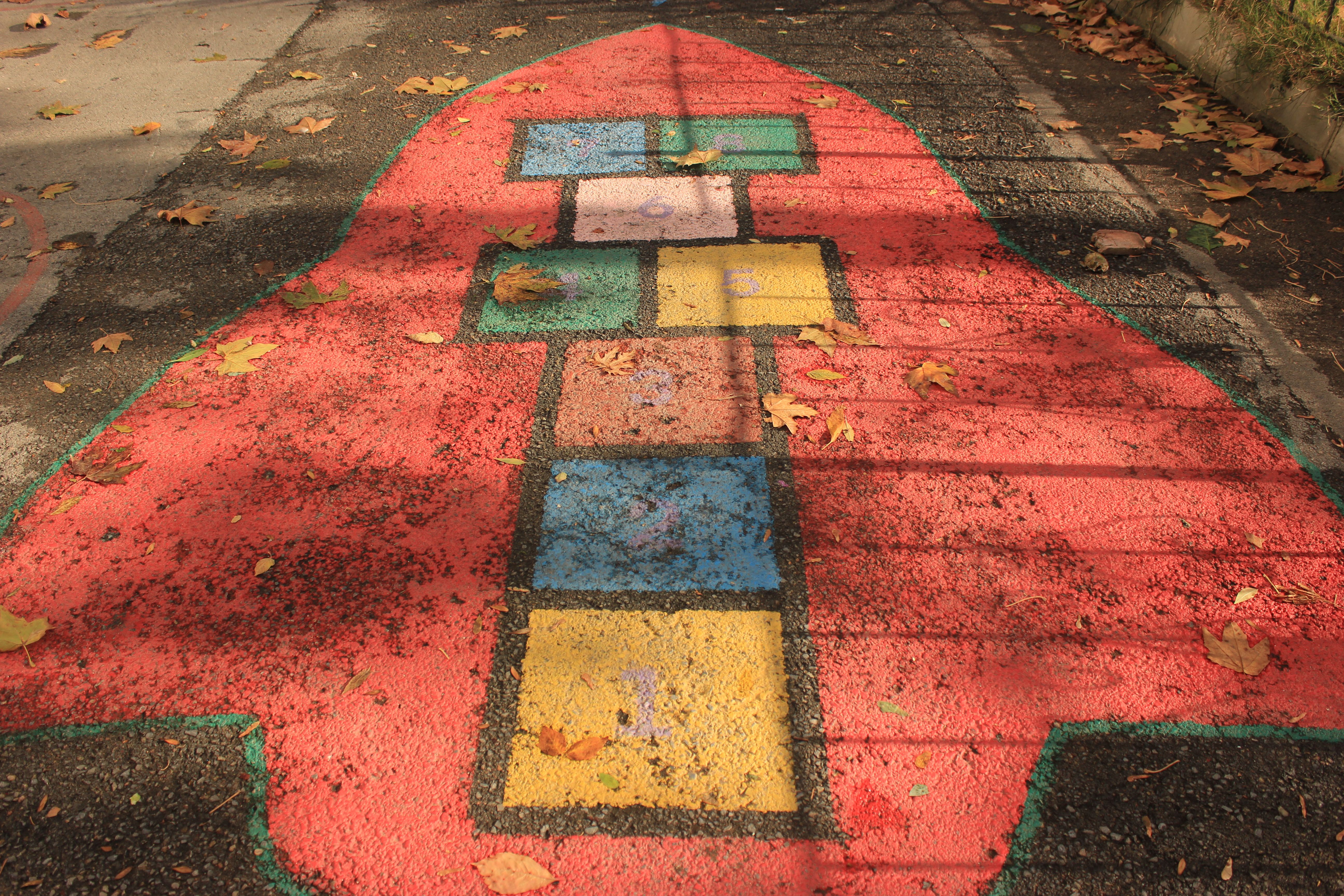 Colorful hopscotch game on outdoor playground · Free Stock Photo