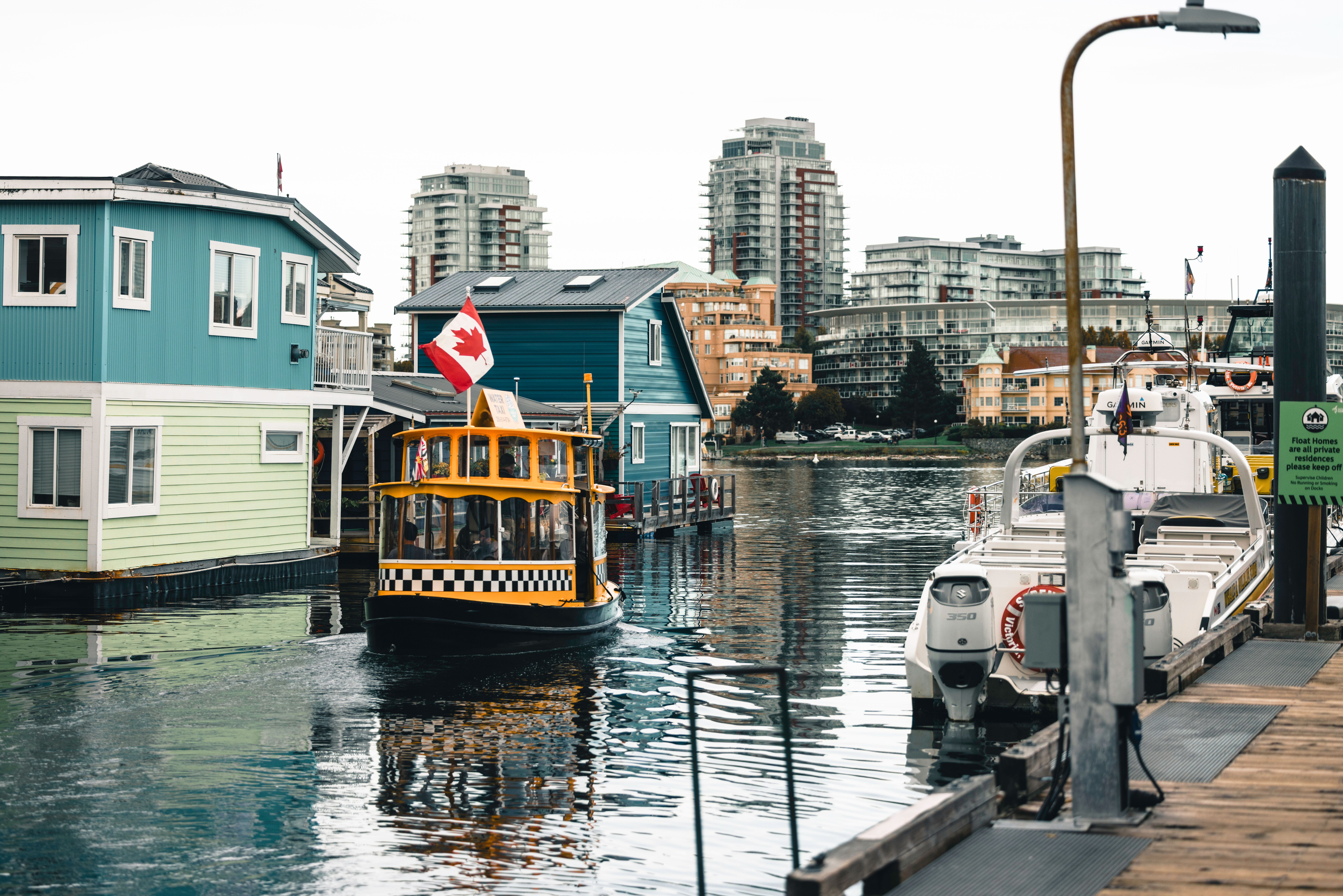 Scenic Waterfront with Water Taxi in Victoria · Free Stock Photo