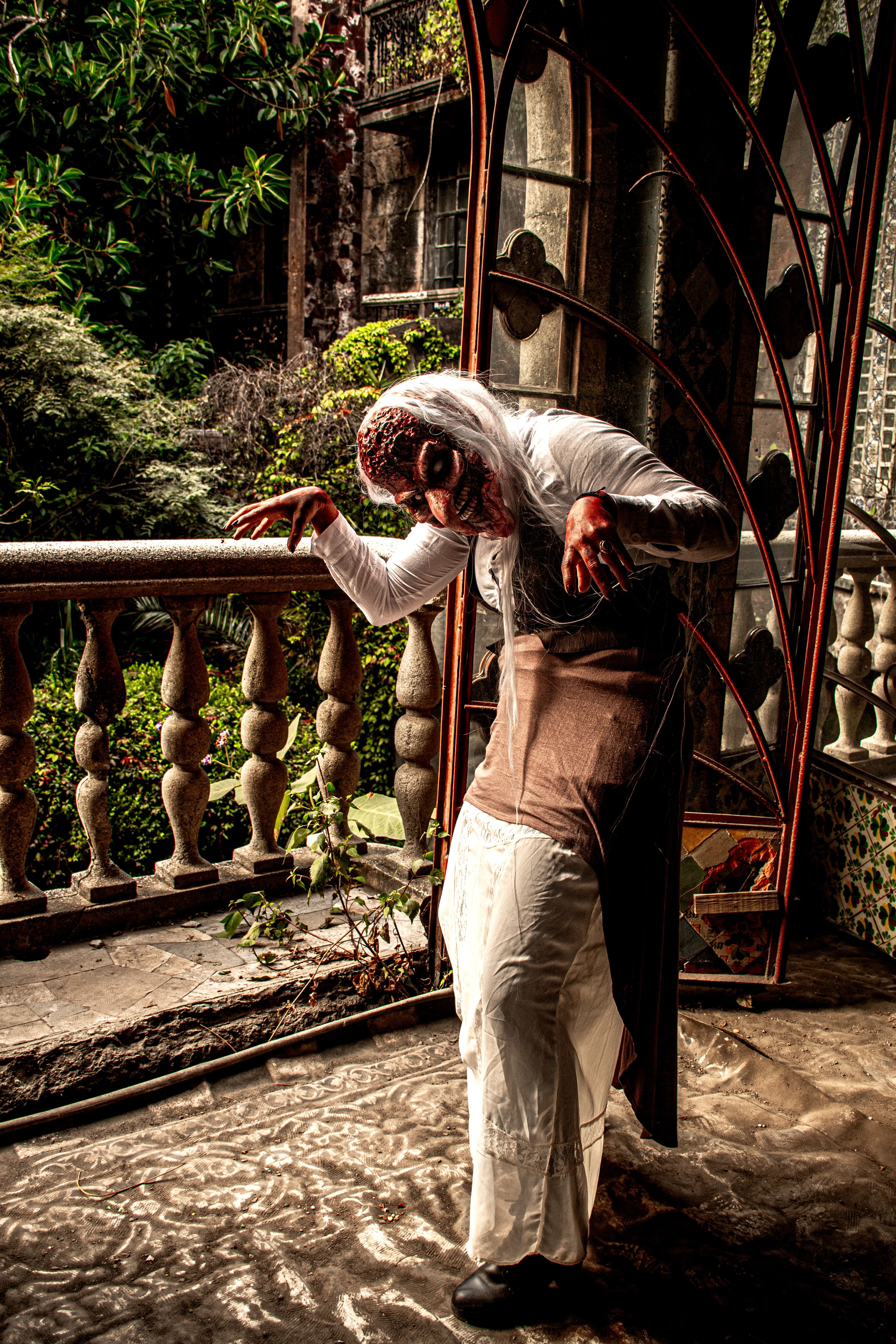 Creepy Zombie Costume in Haunted Setting · Free Stock Photo
