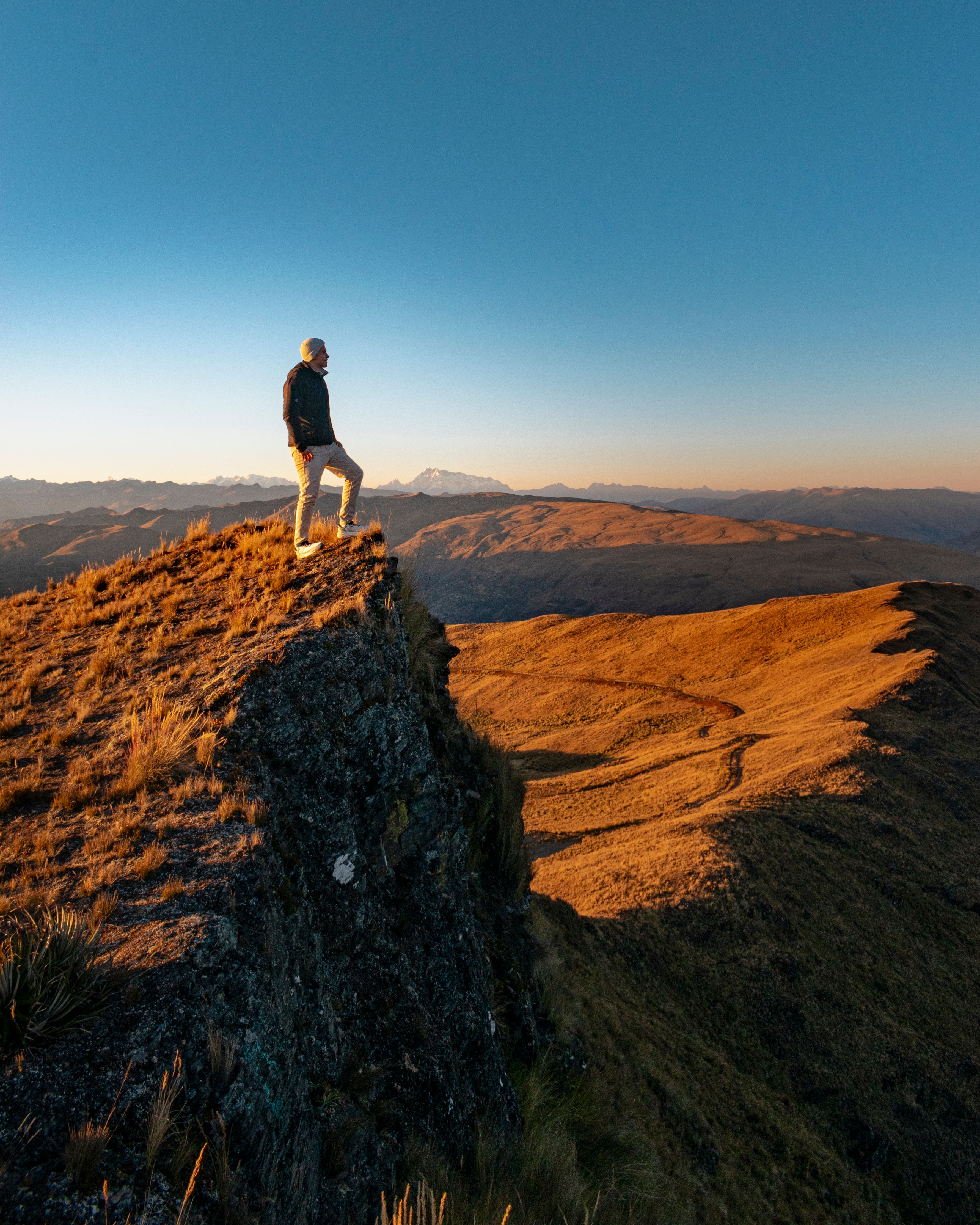 Hiker on Mountain Peak Overlooking Andean Sunrise · Free Stock Photo