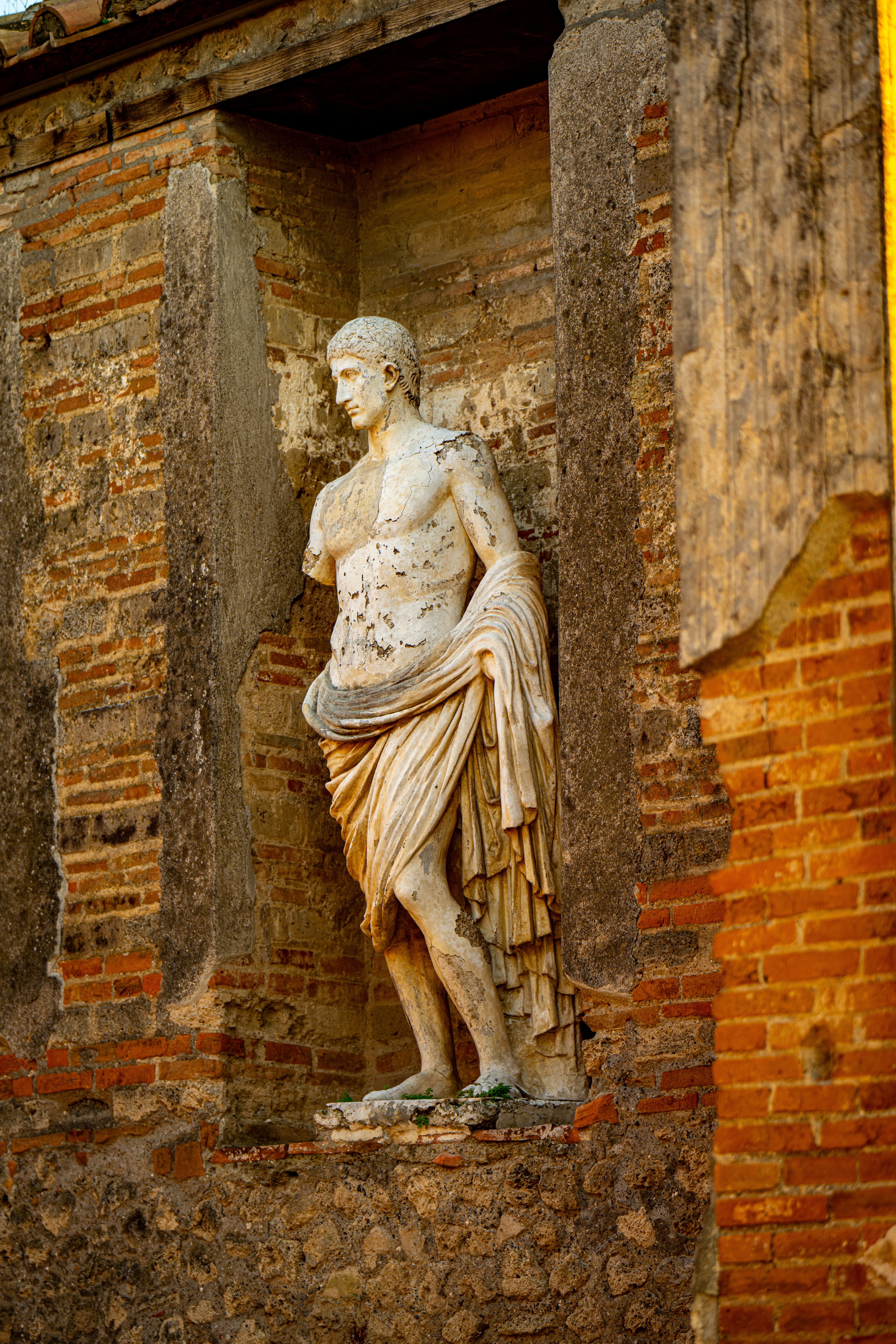 Ancient Statue in Pompei Stone Wall Alcove · Free Stock Photo