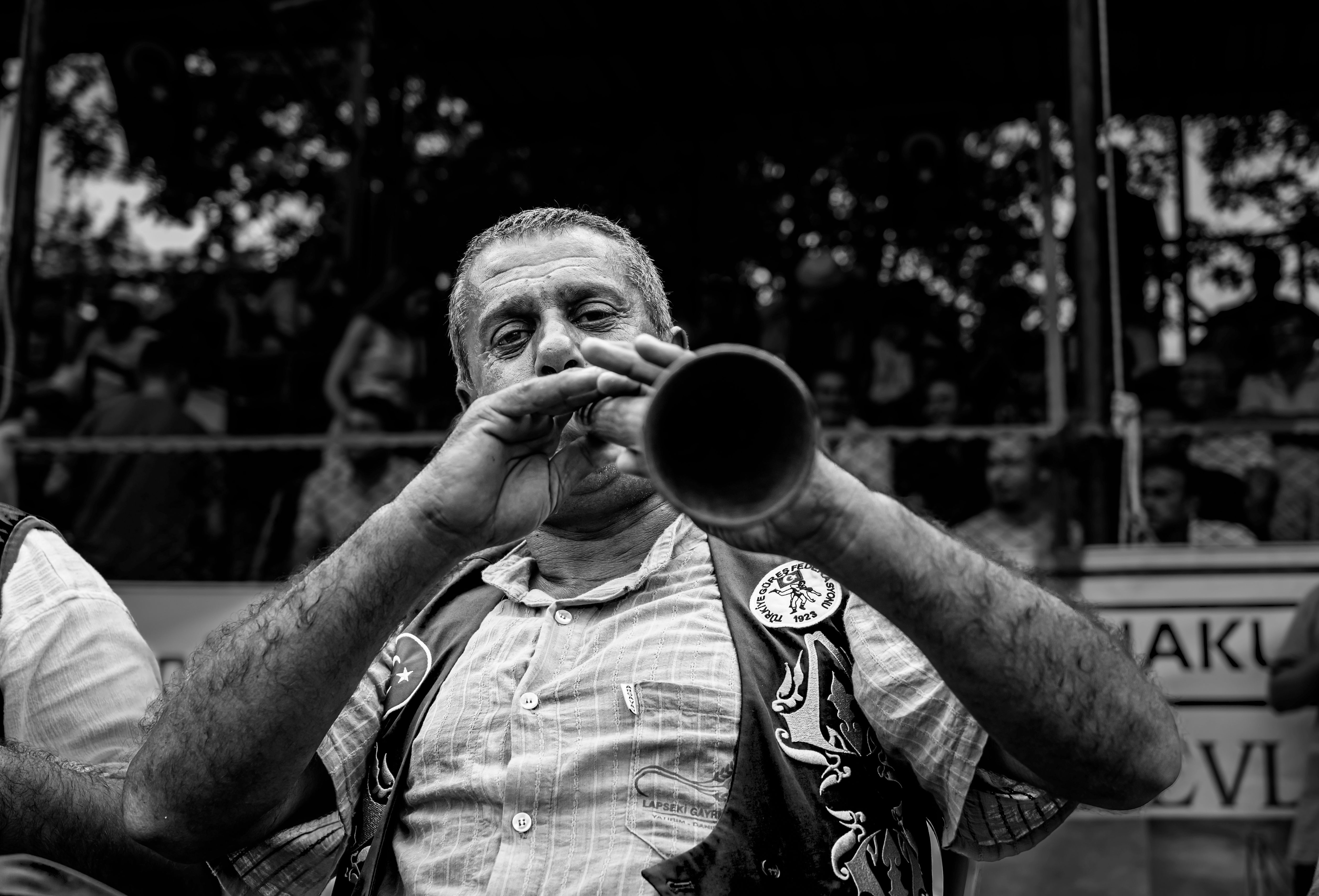 Musician Playing Traditional Horn at Festival · Free Stock Photo