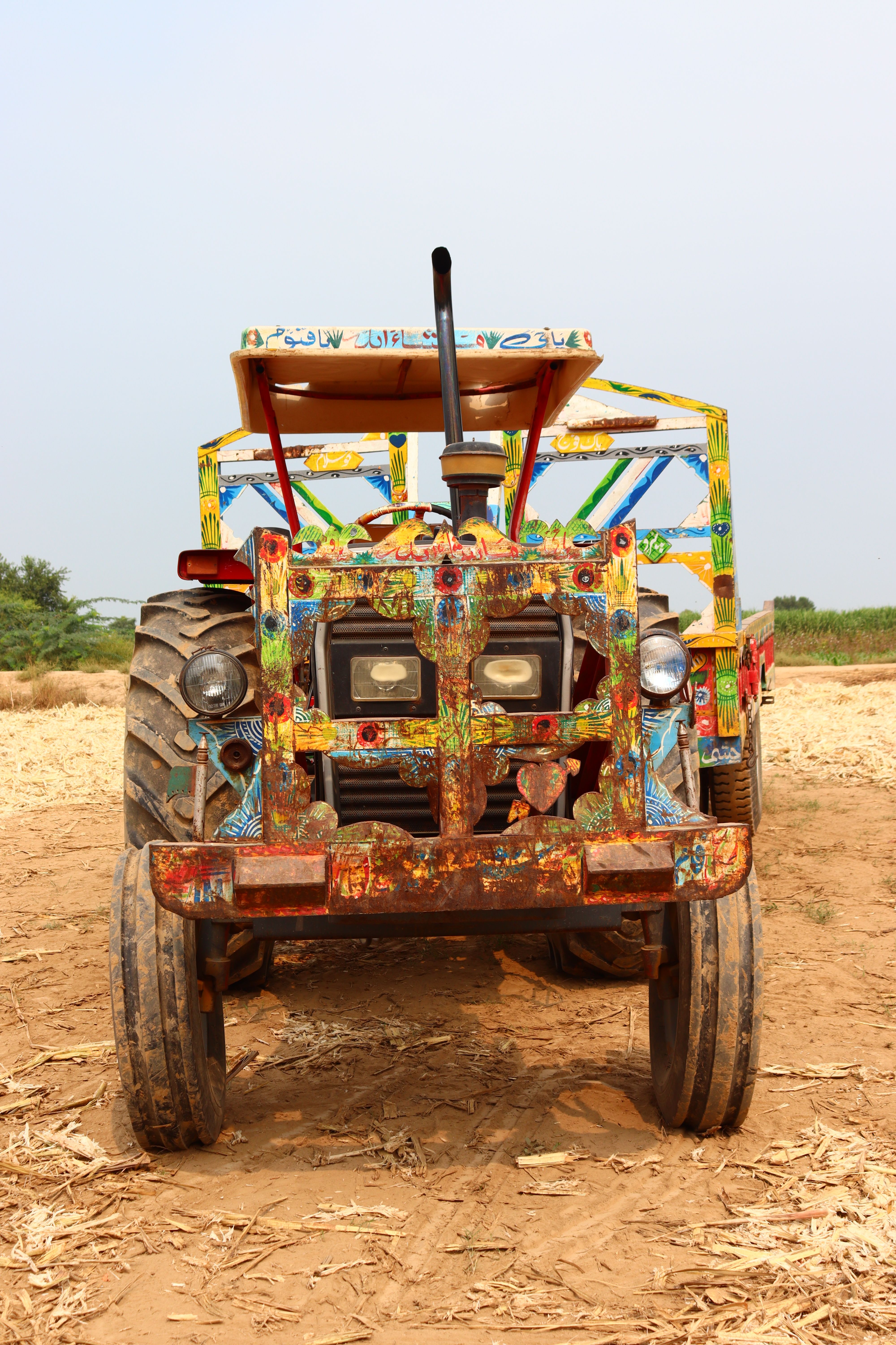 Colorful and Artistic Painted Tractor in Rural Field · Free Stock Photo