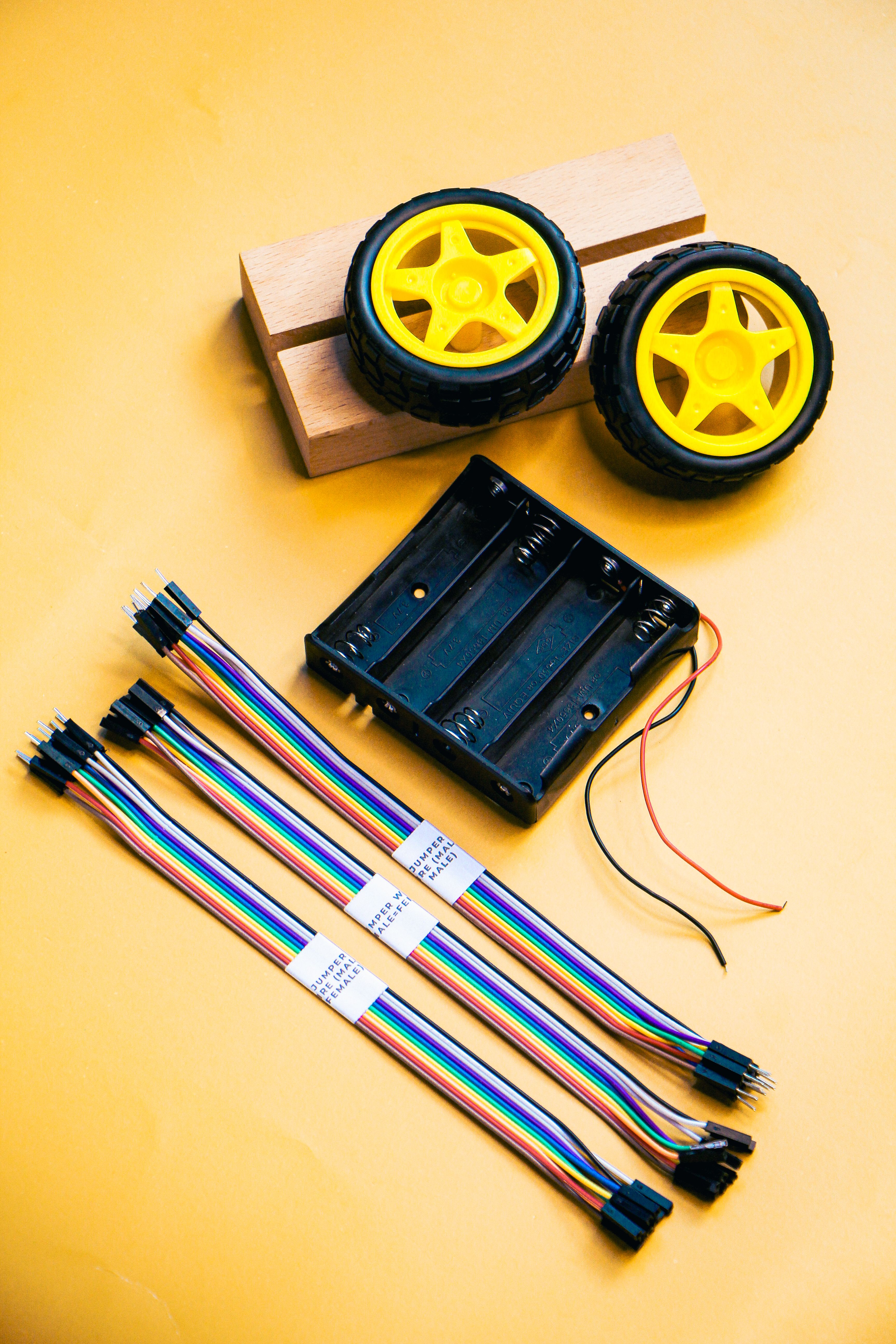 Yellow Robotics Kit Components on Yellow Background · Free Stock Photo