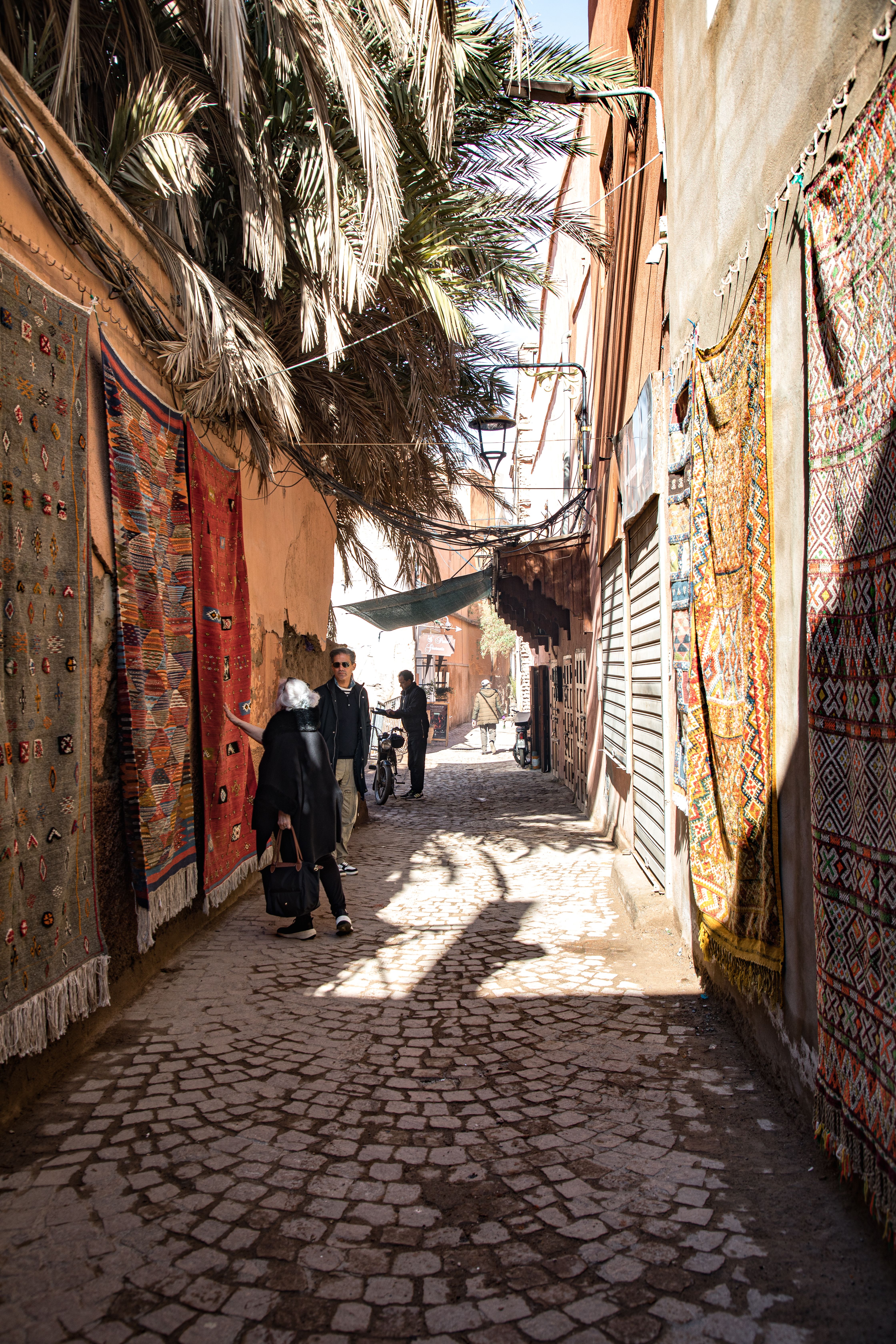 Colorful Marrakesh Street with Hanging Rugs · Free Stock Photo