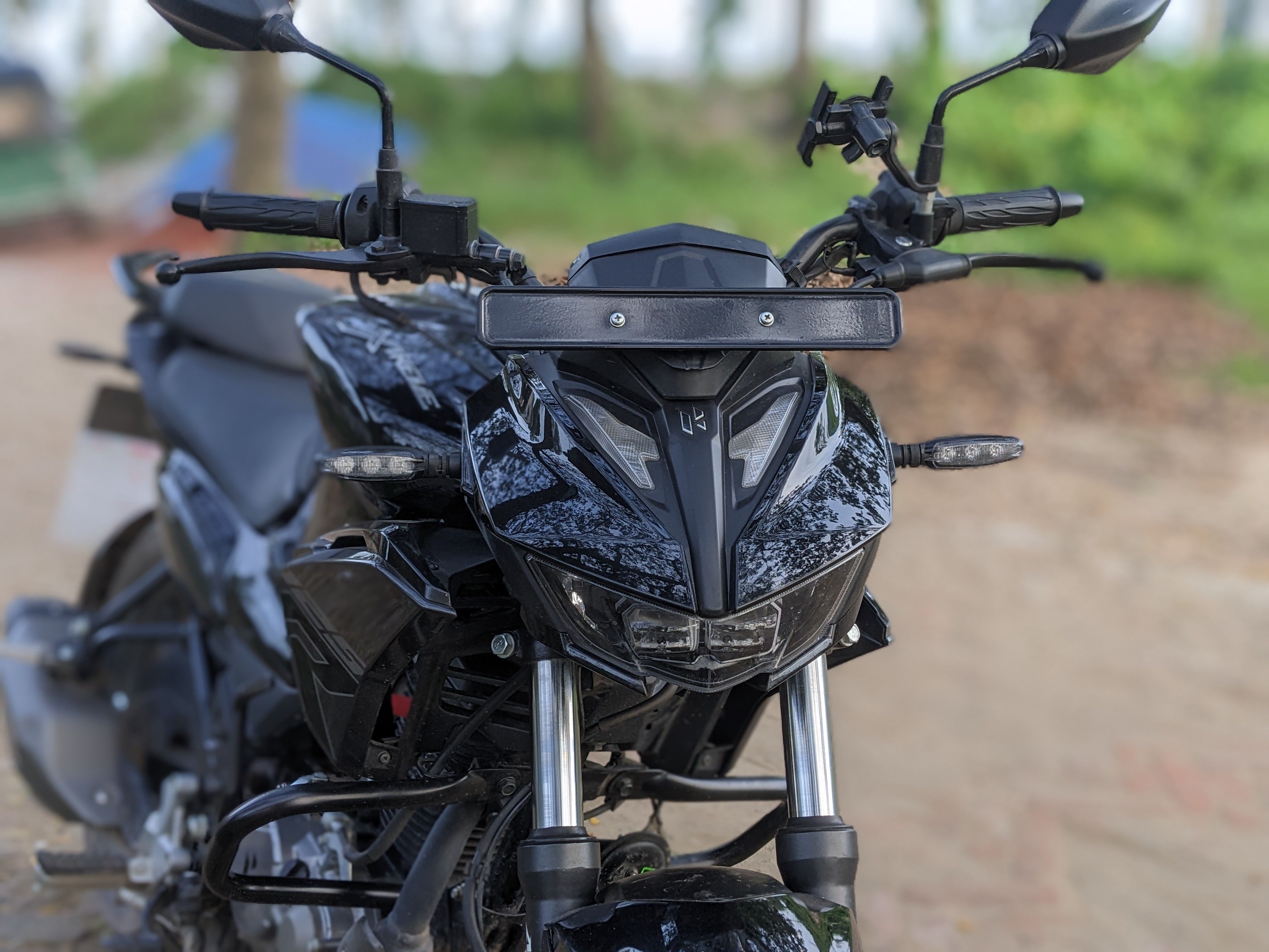 Close-up of a Black Motorcycle in Outdoor Setting · Free Stock Photo