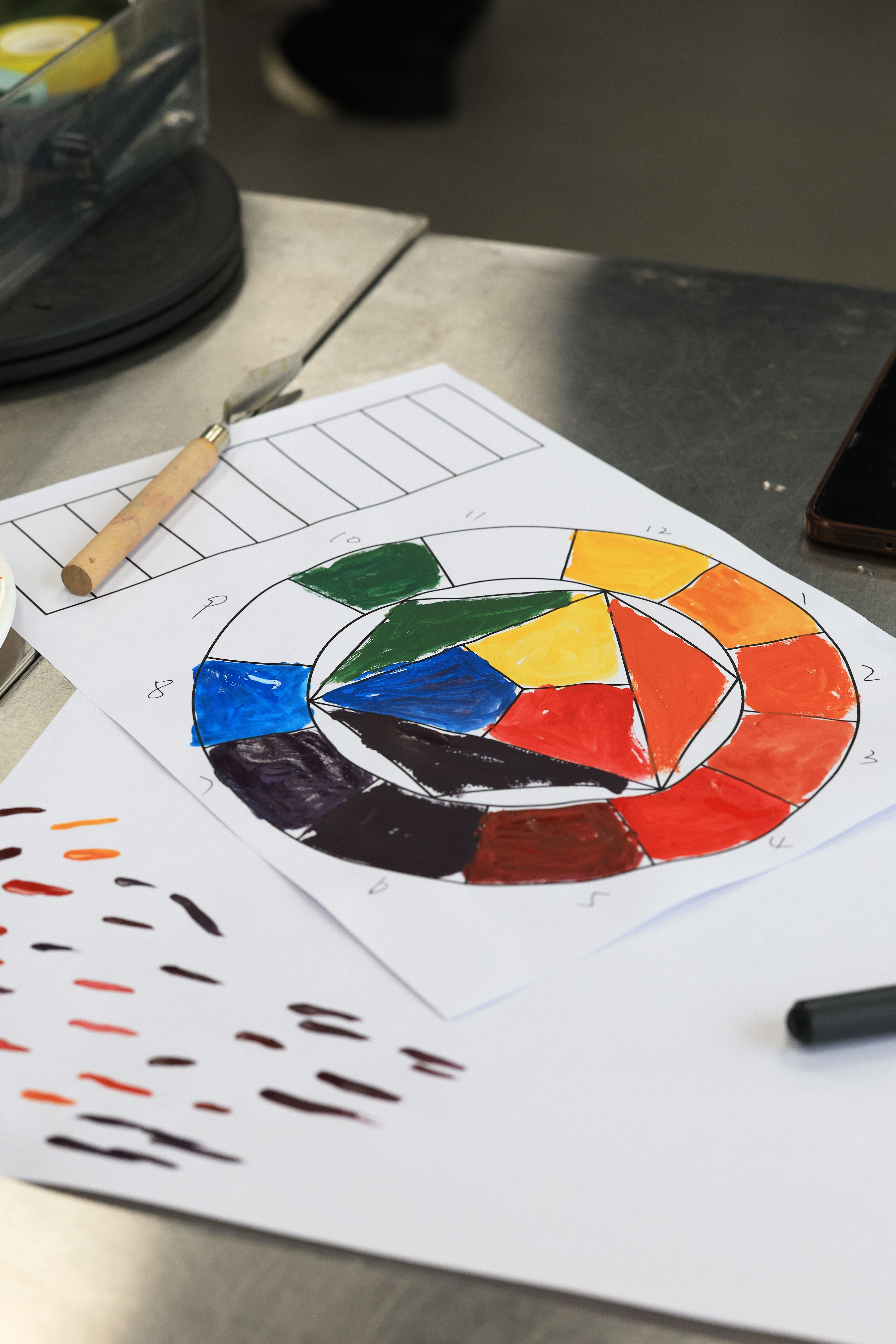Color Wheel with Paint Samples and Artistic Tools · Free Stock Photo