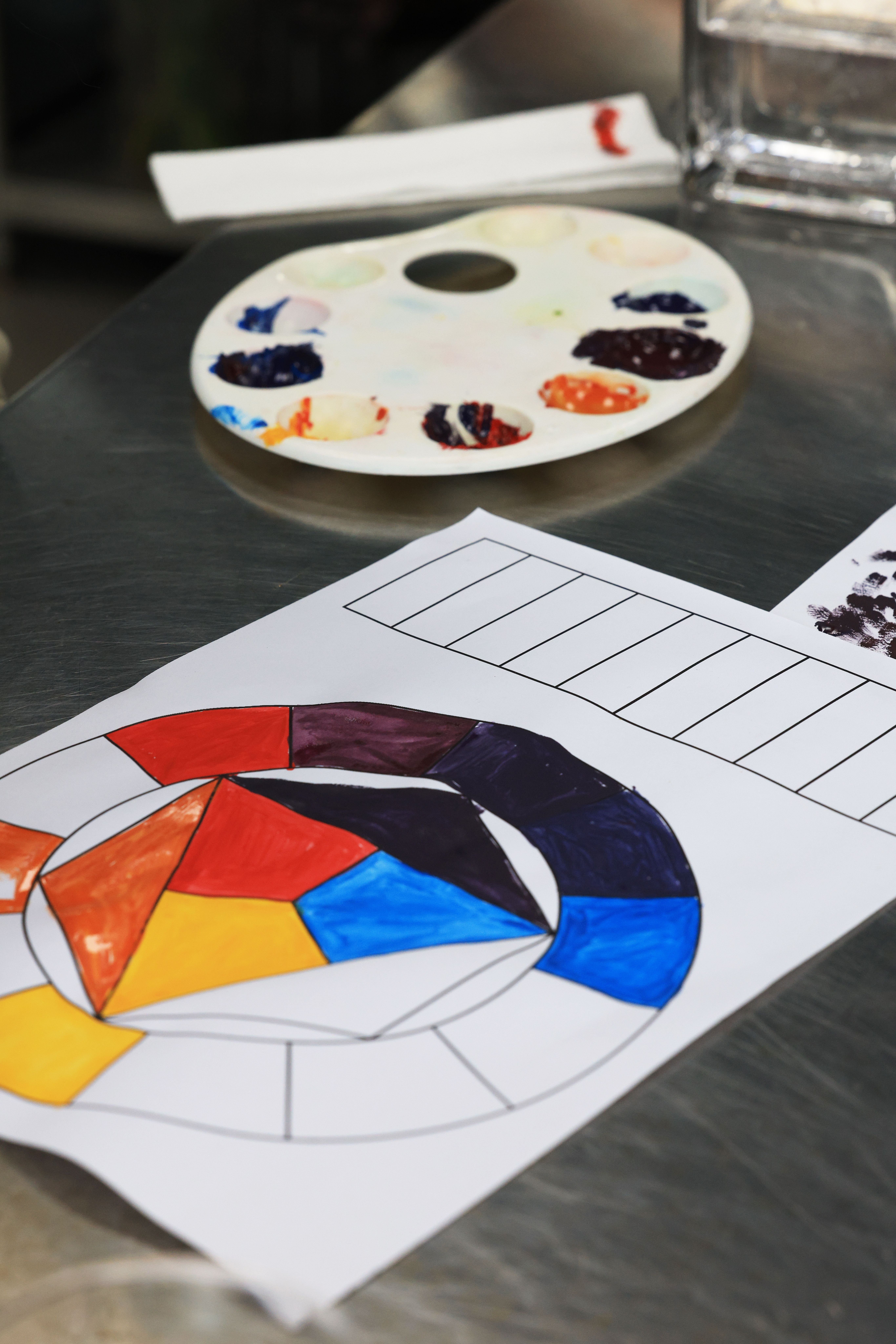 Color Theory Study with Paint Palette and Chart · Free Stock Photo