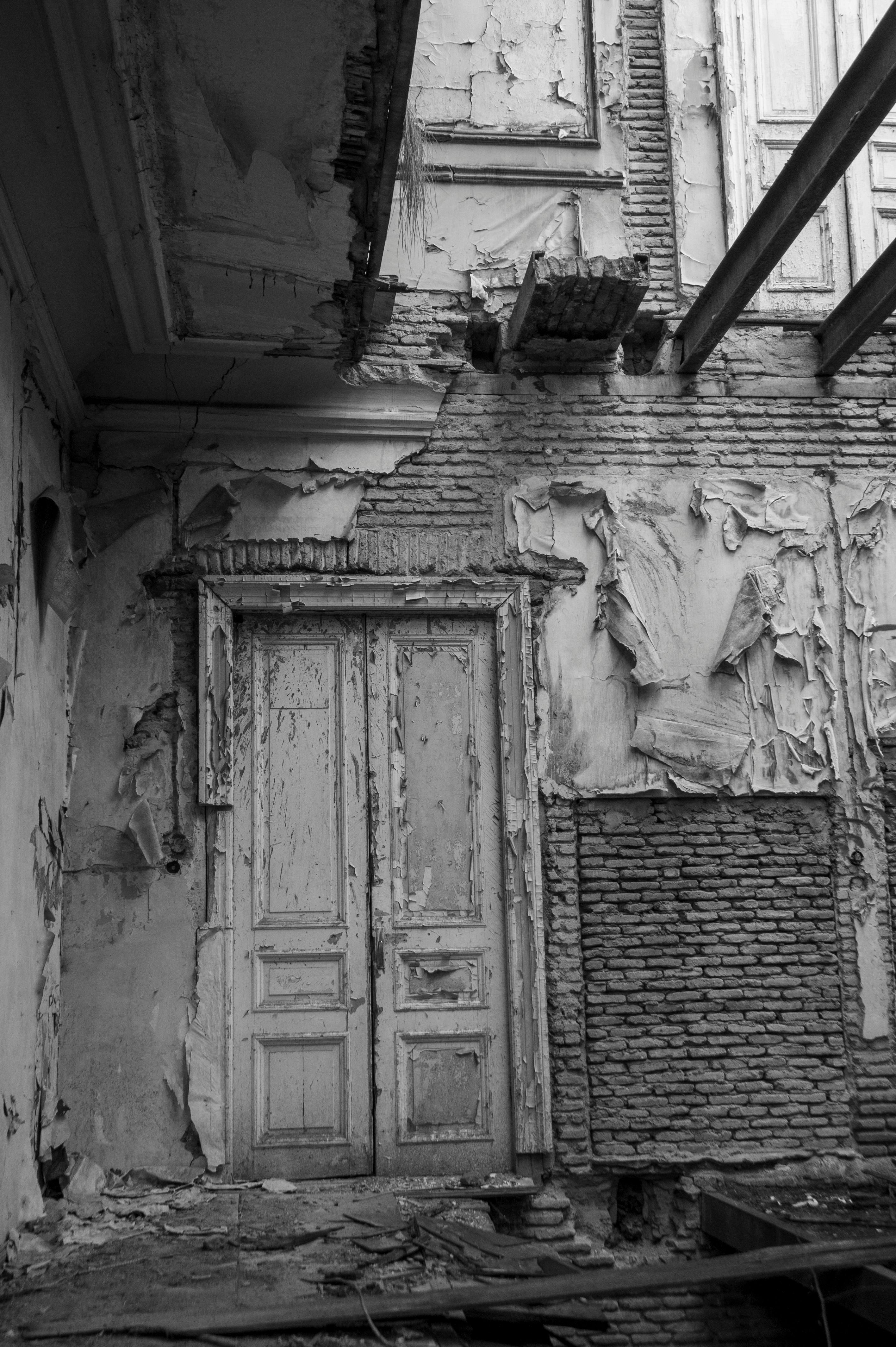 Abandoned Building with Peeling Walls and Door · Free Stock Photo