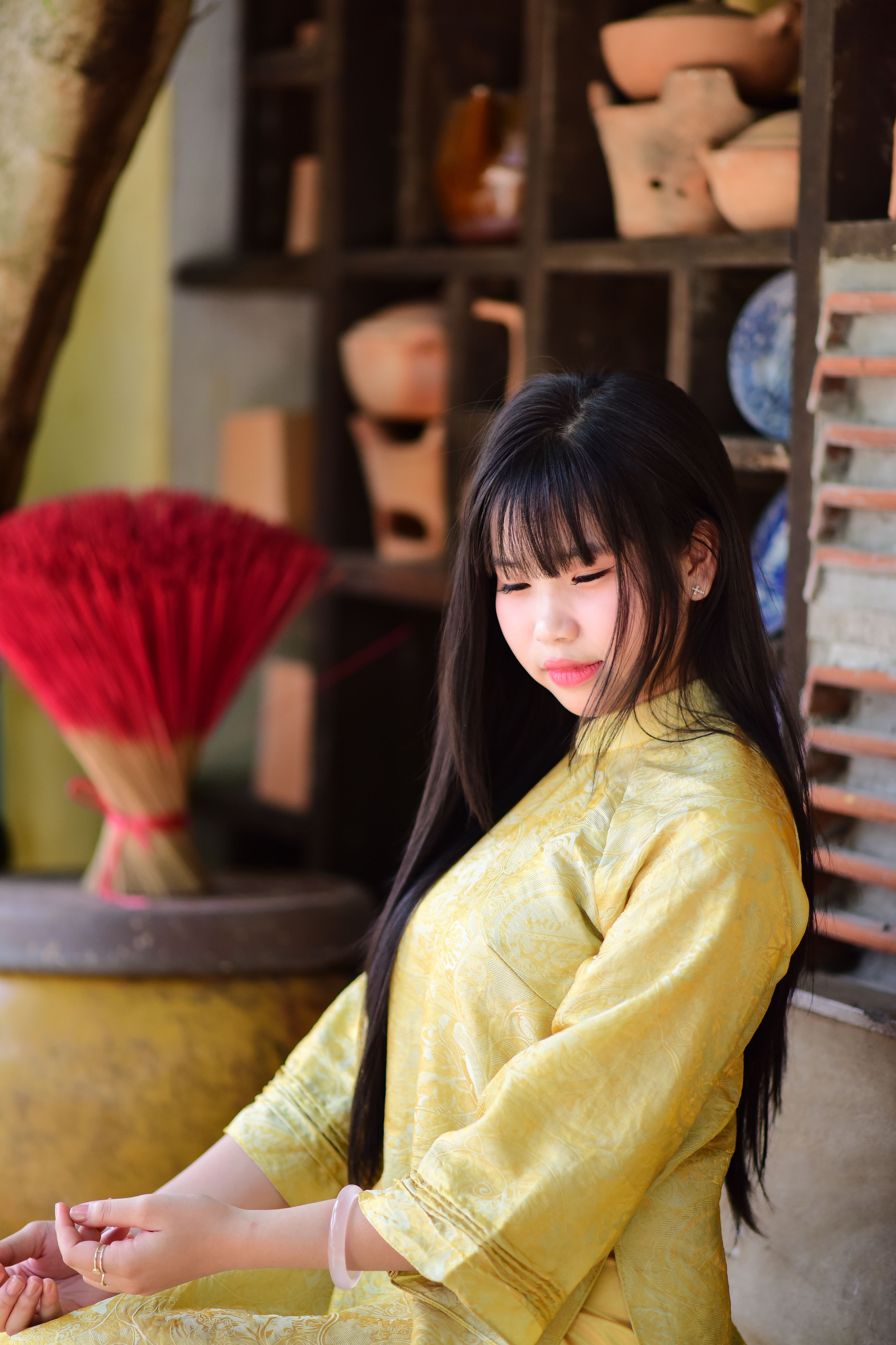 Portrait of a Woman in Traditional Yellow Dress · Free Stock Photo