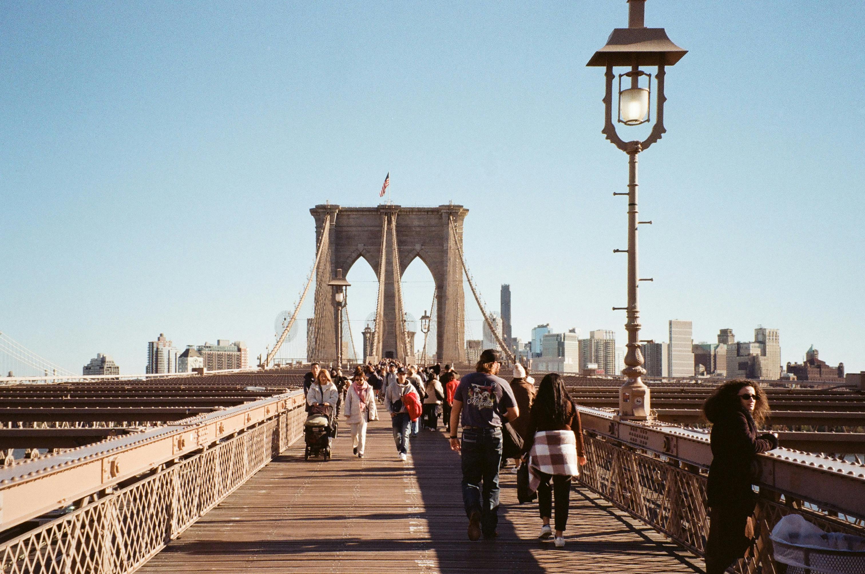 Walking Across Brooklyn Bridge in New York City · Free Stock Photo
