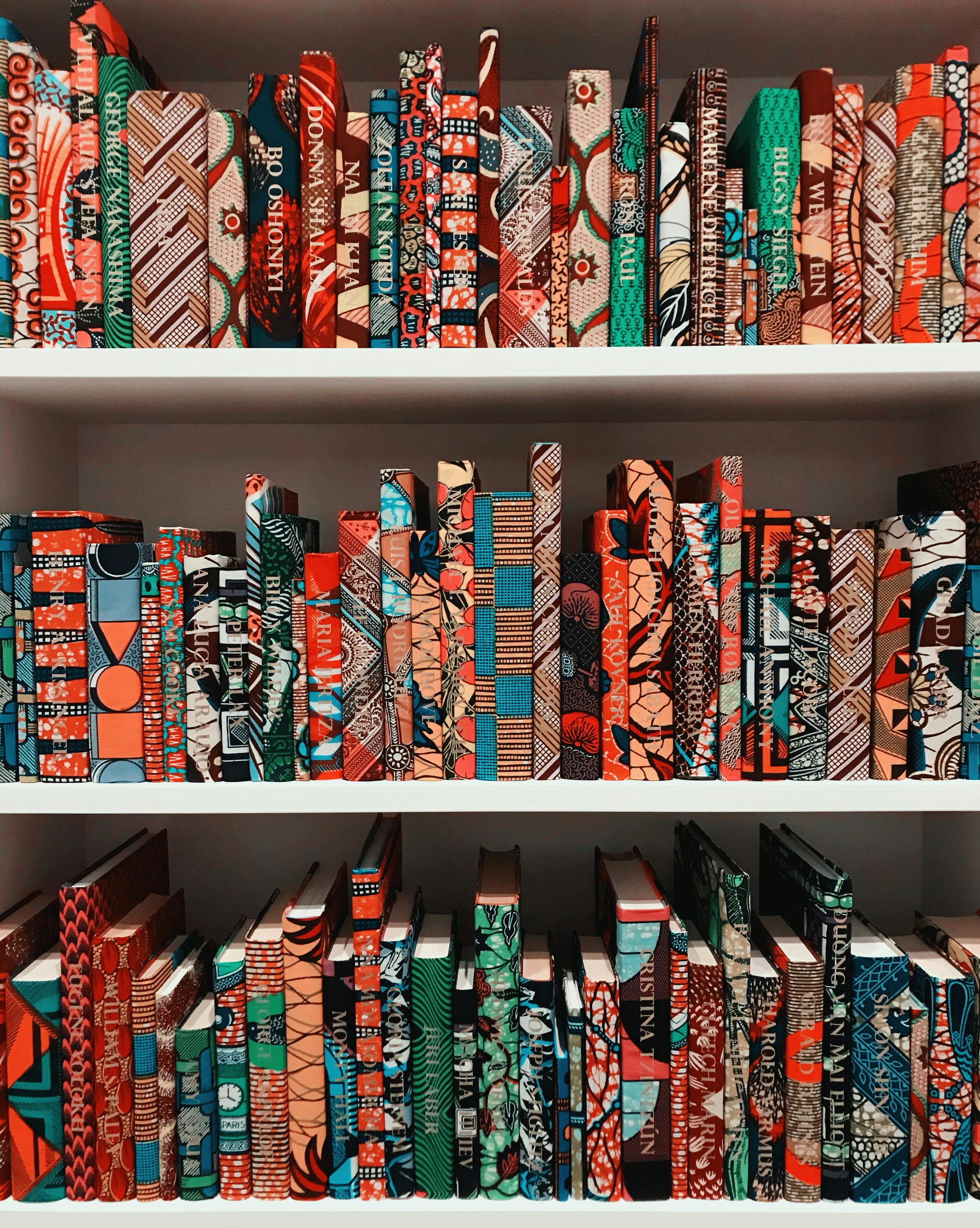 Bundle of Books on a Library · Free Stock Photo