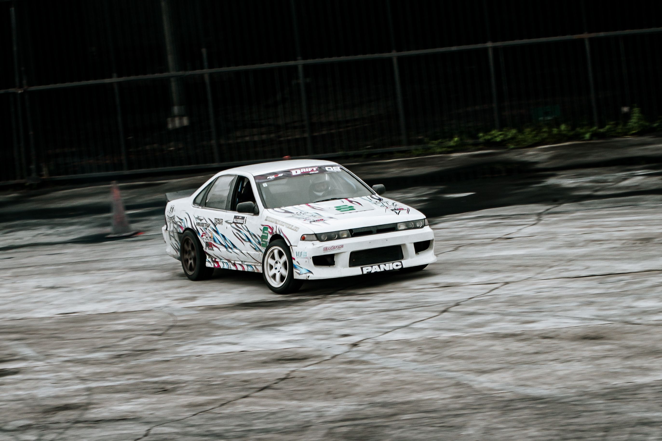 Dynamic Drift Car on Wet Asphalt Track · Free Stock Photo